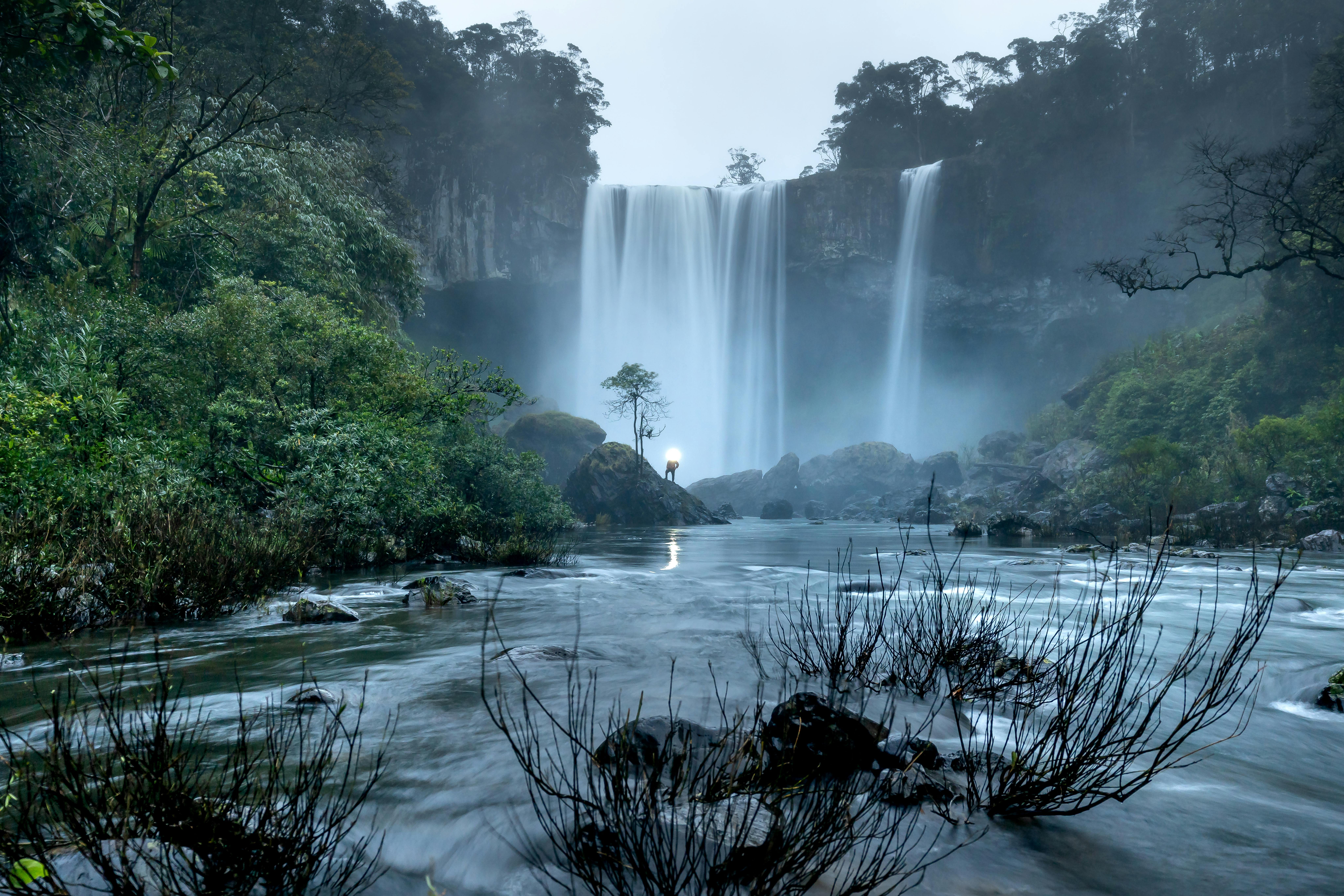 Person Standing near Waterfall · Free Stock Photo