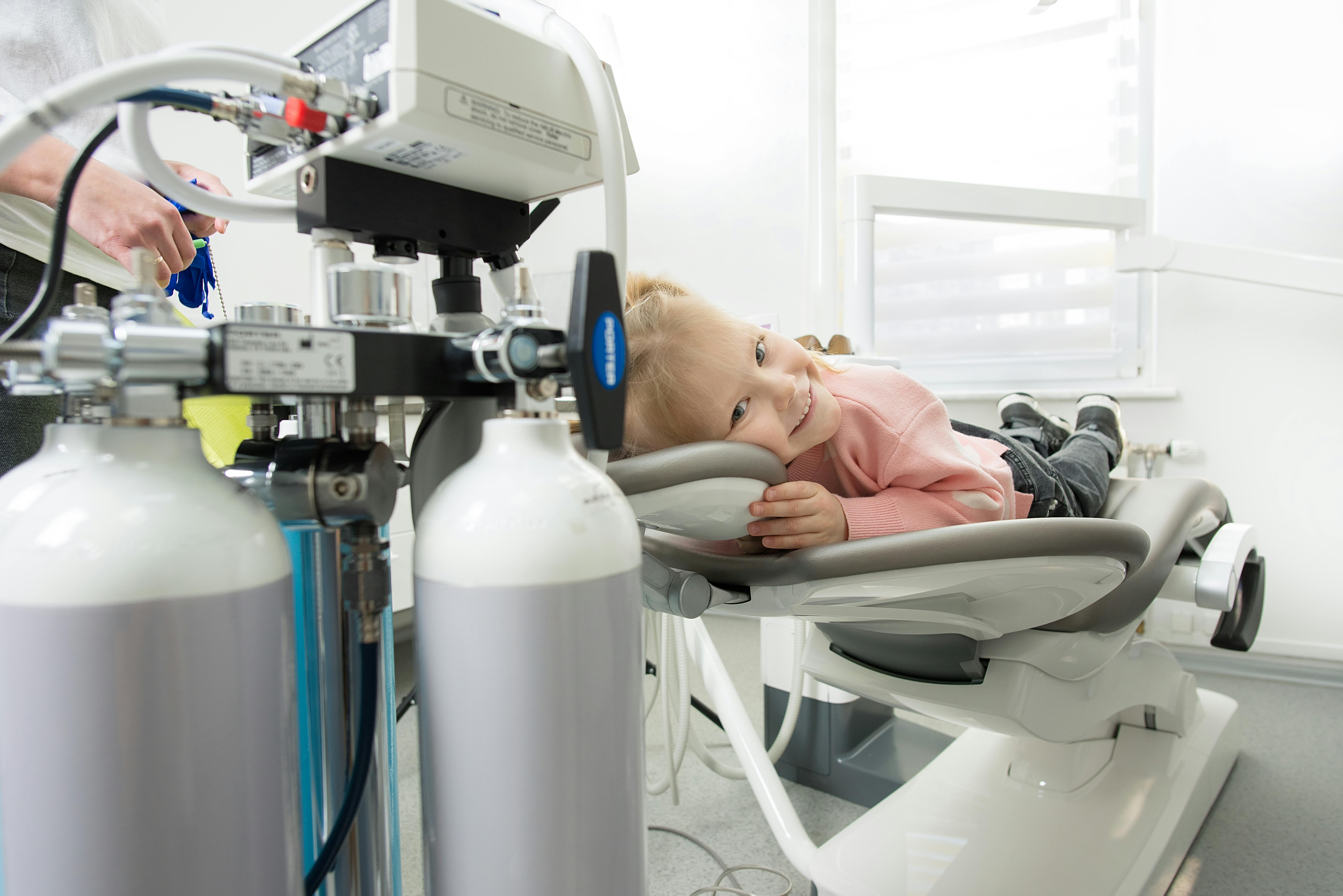 Kid Lying on Dental Treatment Chair · Free Stock Photo