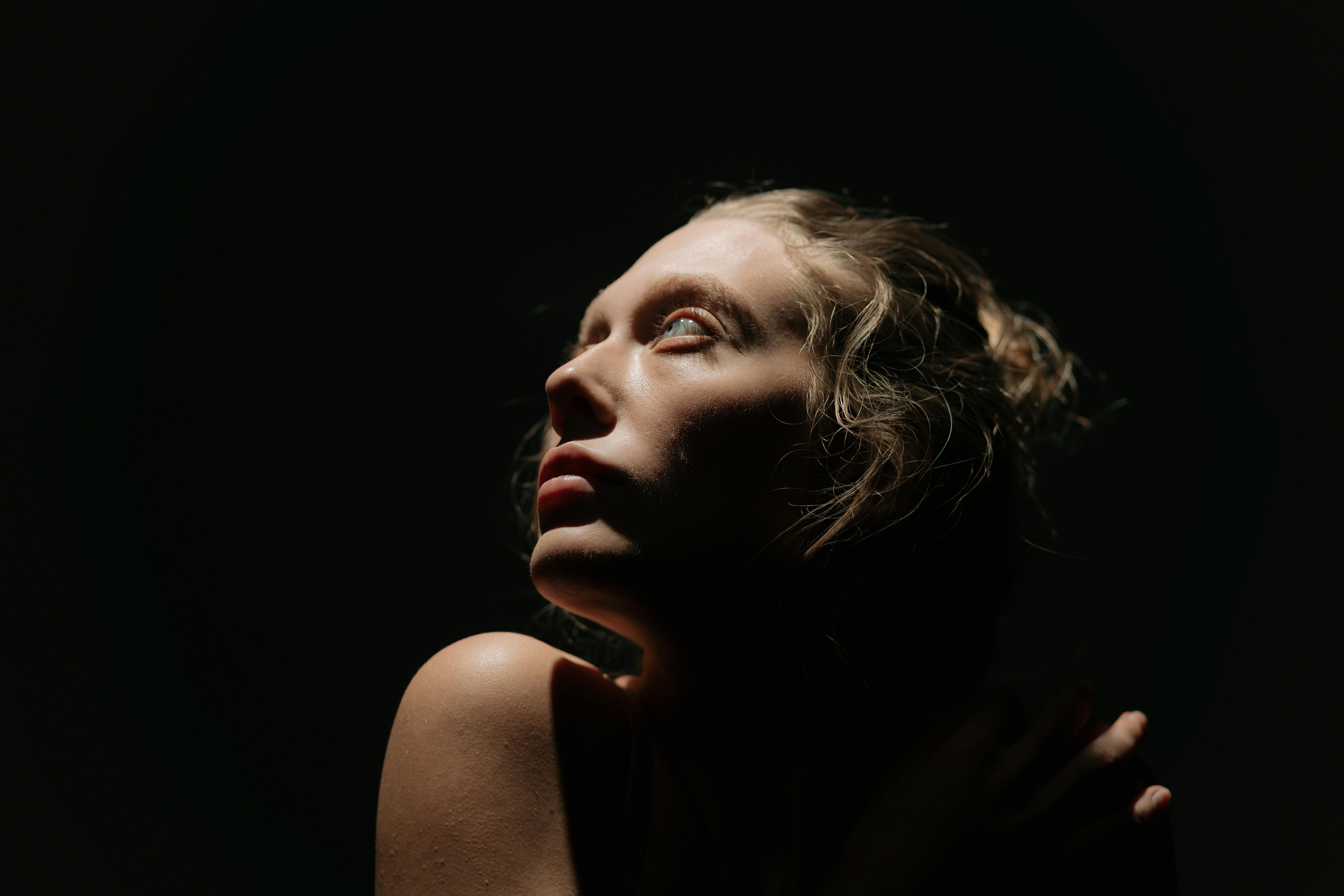 Low-Angle Shot of a Woman Looking Up · Free Stock Photo