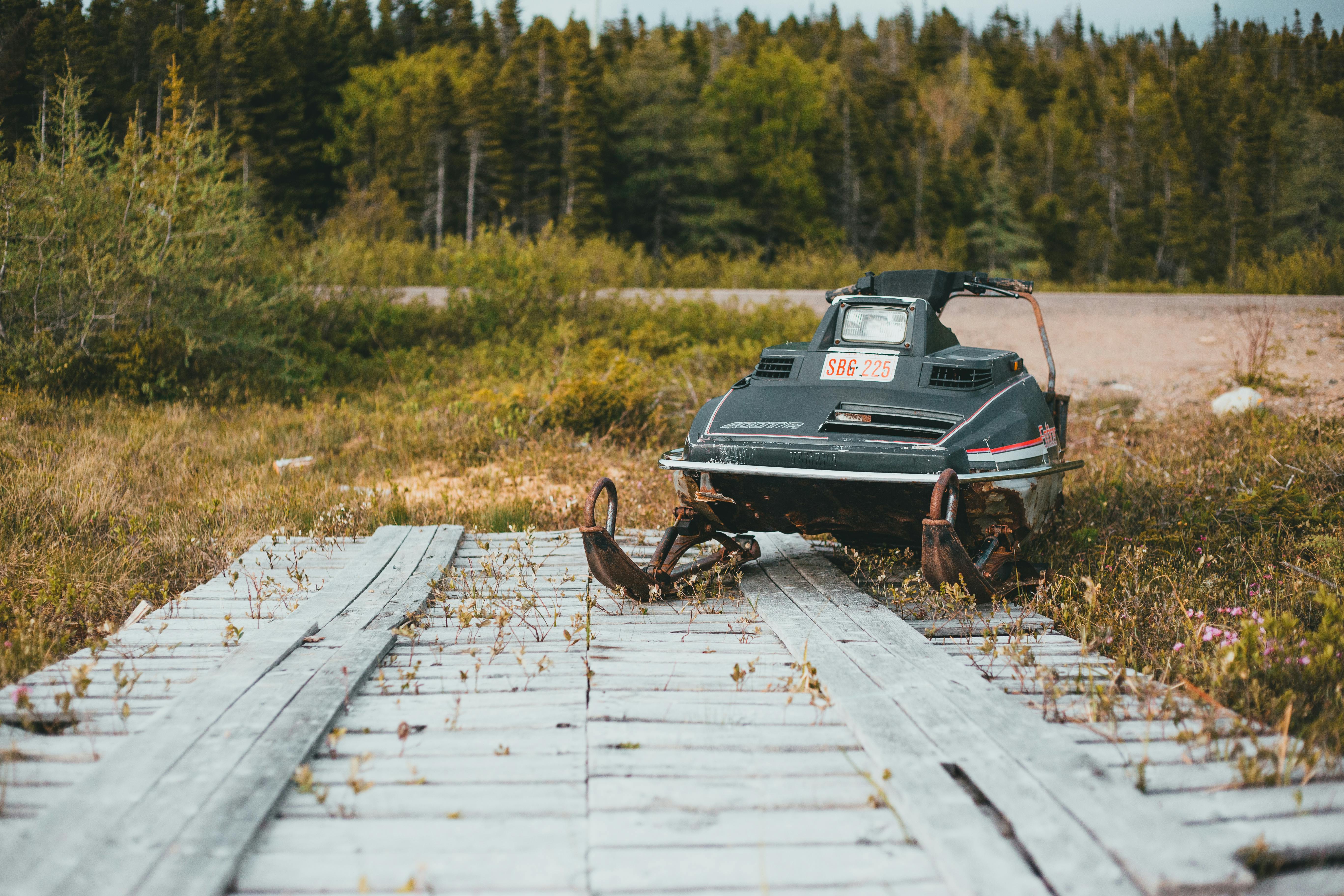 Photo of an Abandoned Snowmobile · Free Stock Photo