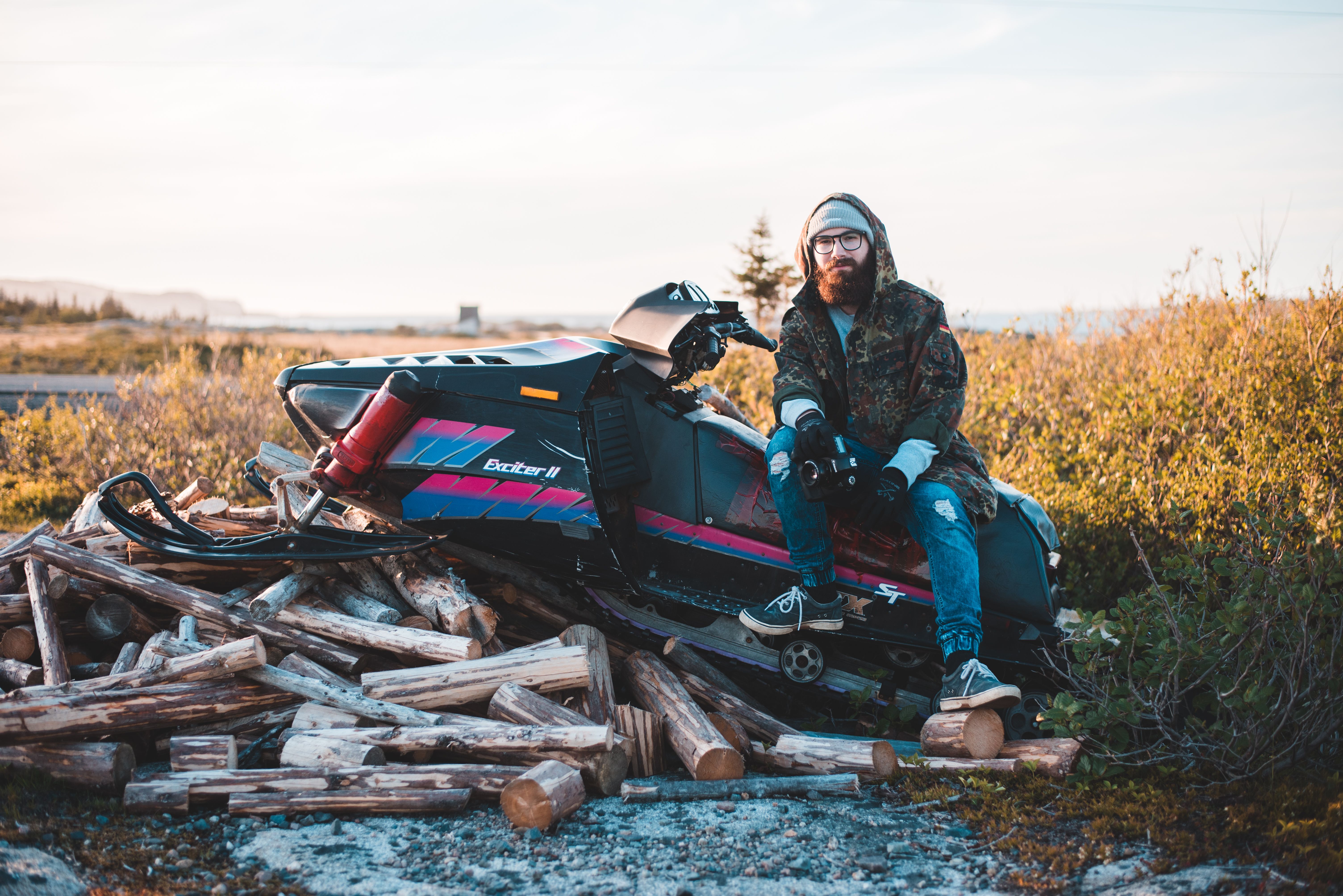 Man Sitting on Snowmobile · Free Stock Photo
