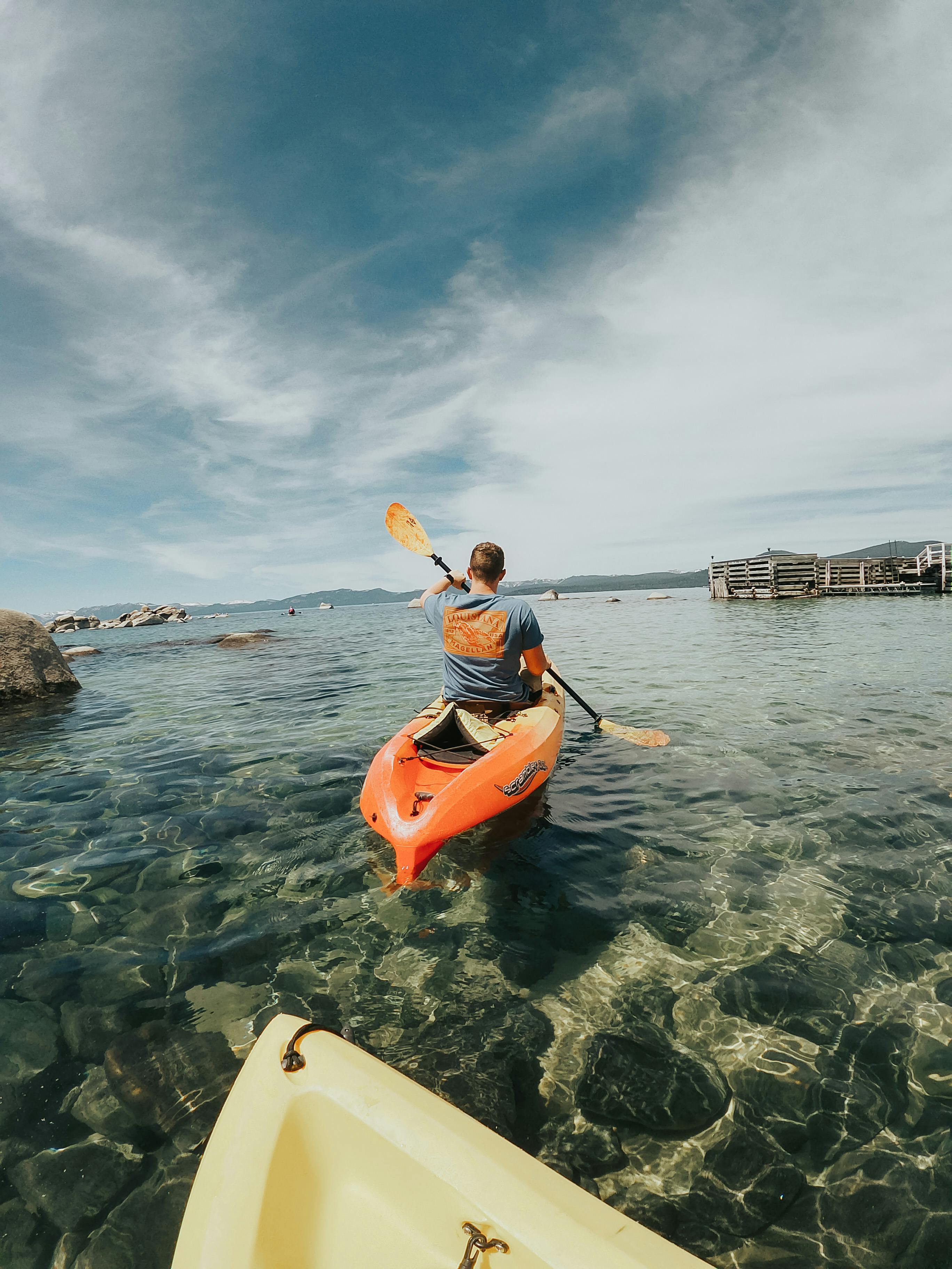 Back View of a Man Riding a Kayak · Free Stock Photo