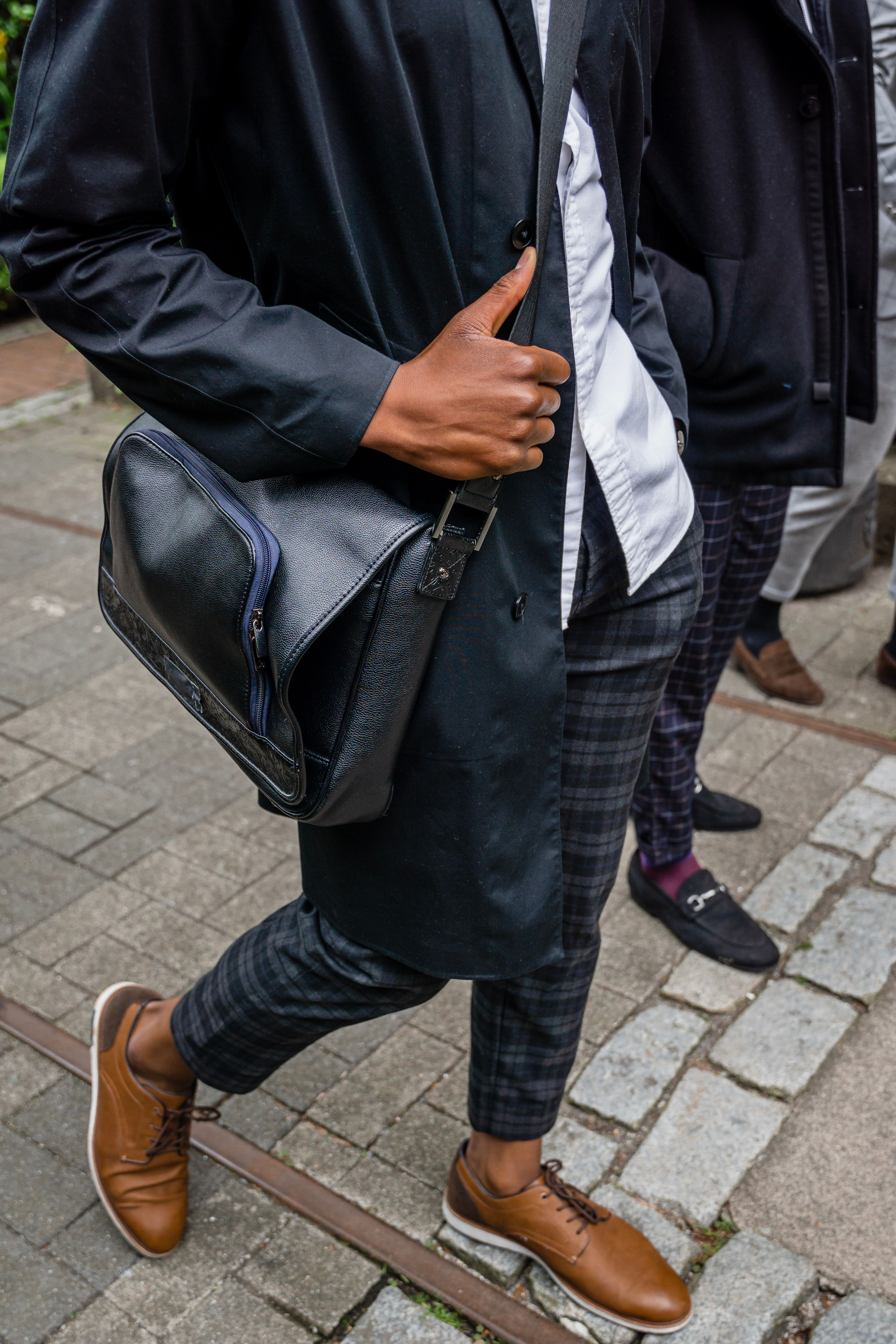 Close-Up Shot of Person Carrying a Bag · Free Stock Photo