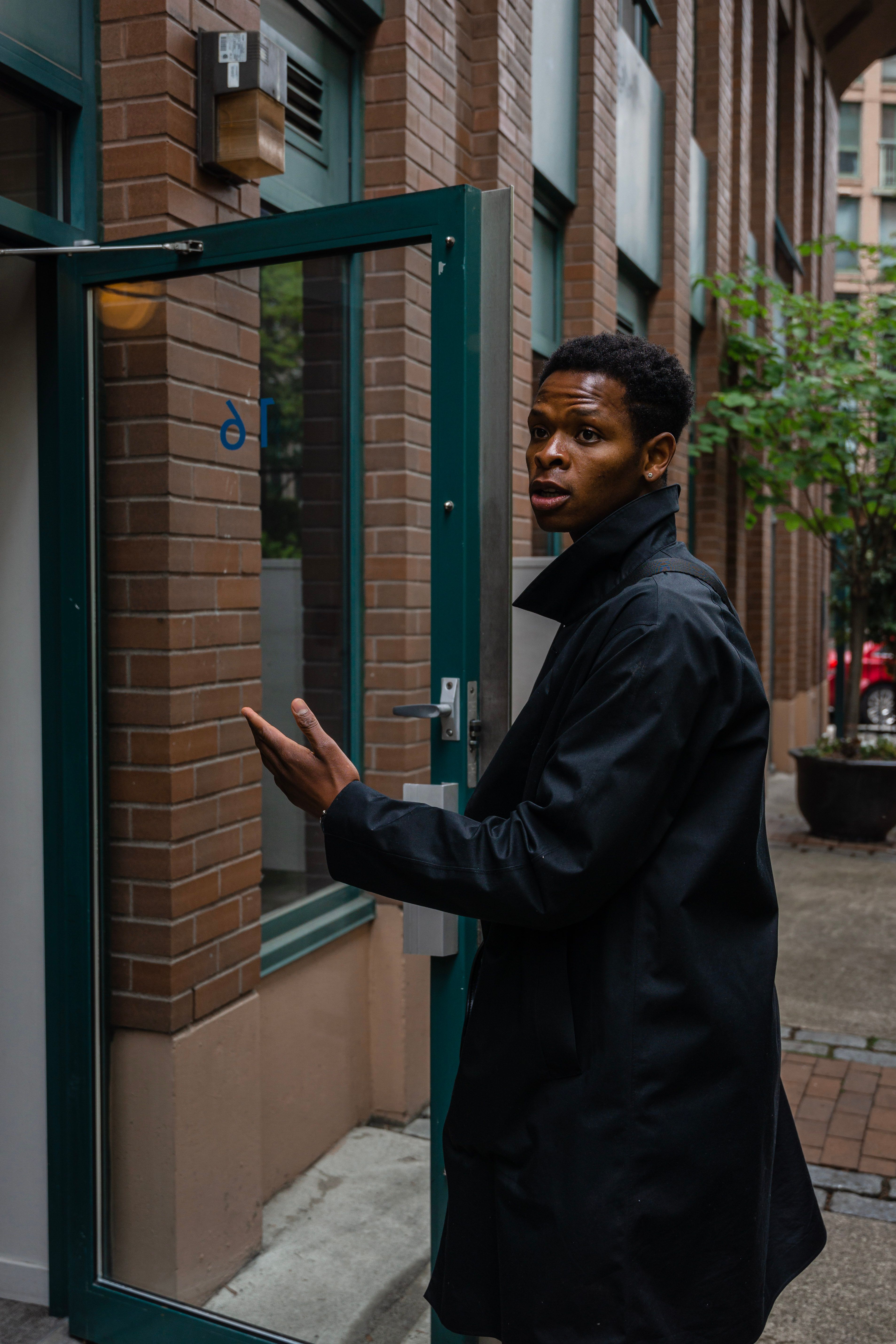 A Man Opening the Door · Free Stock Photo