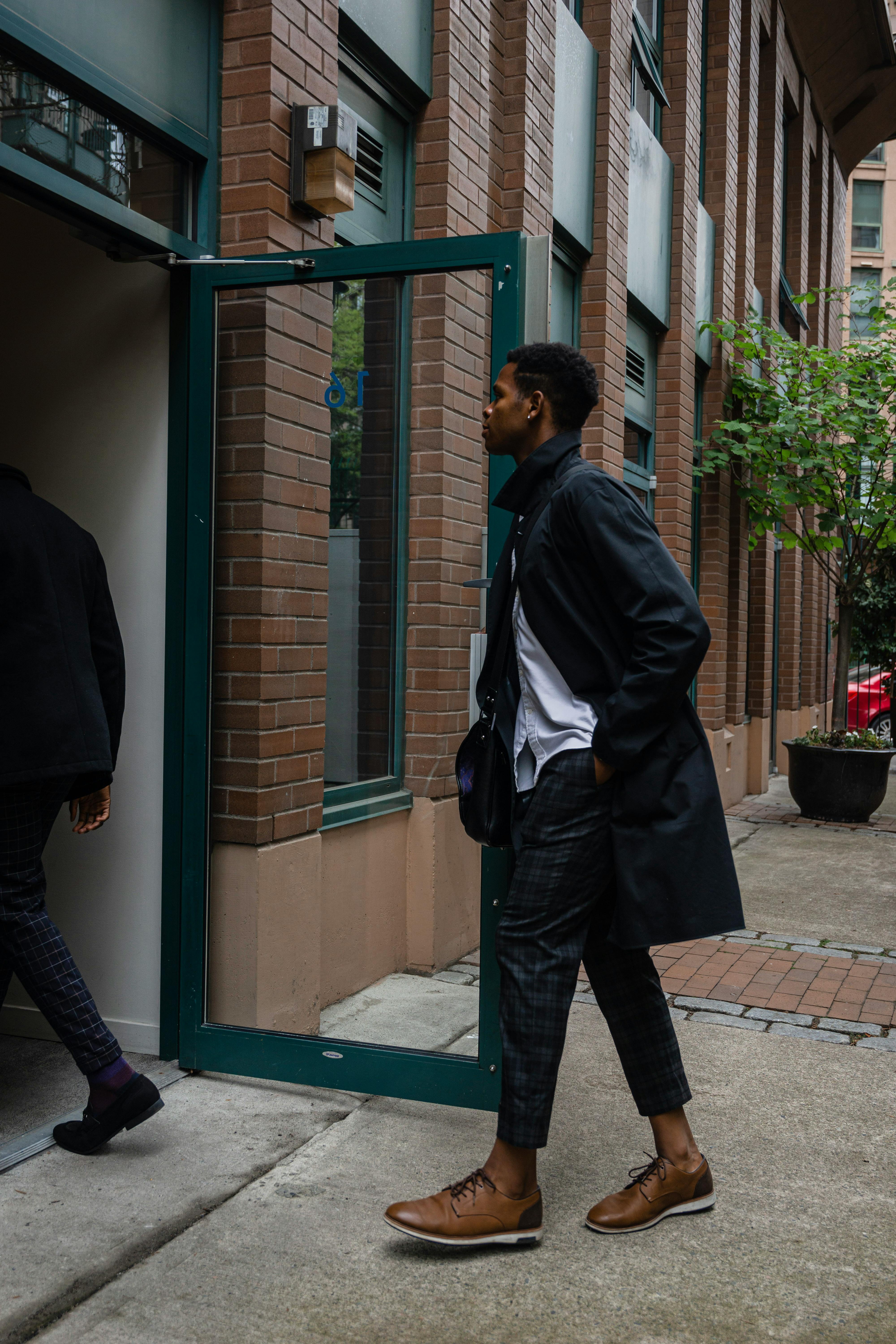A Man Entering a Building · Free Stock Photo