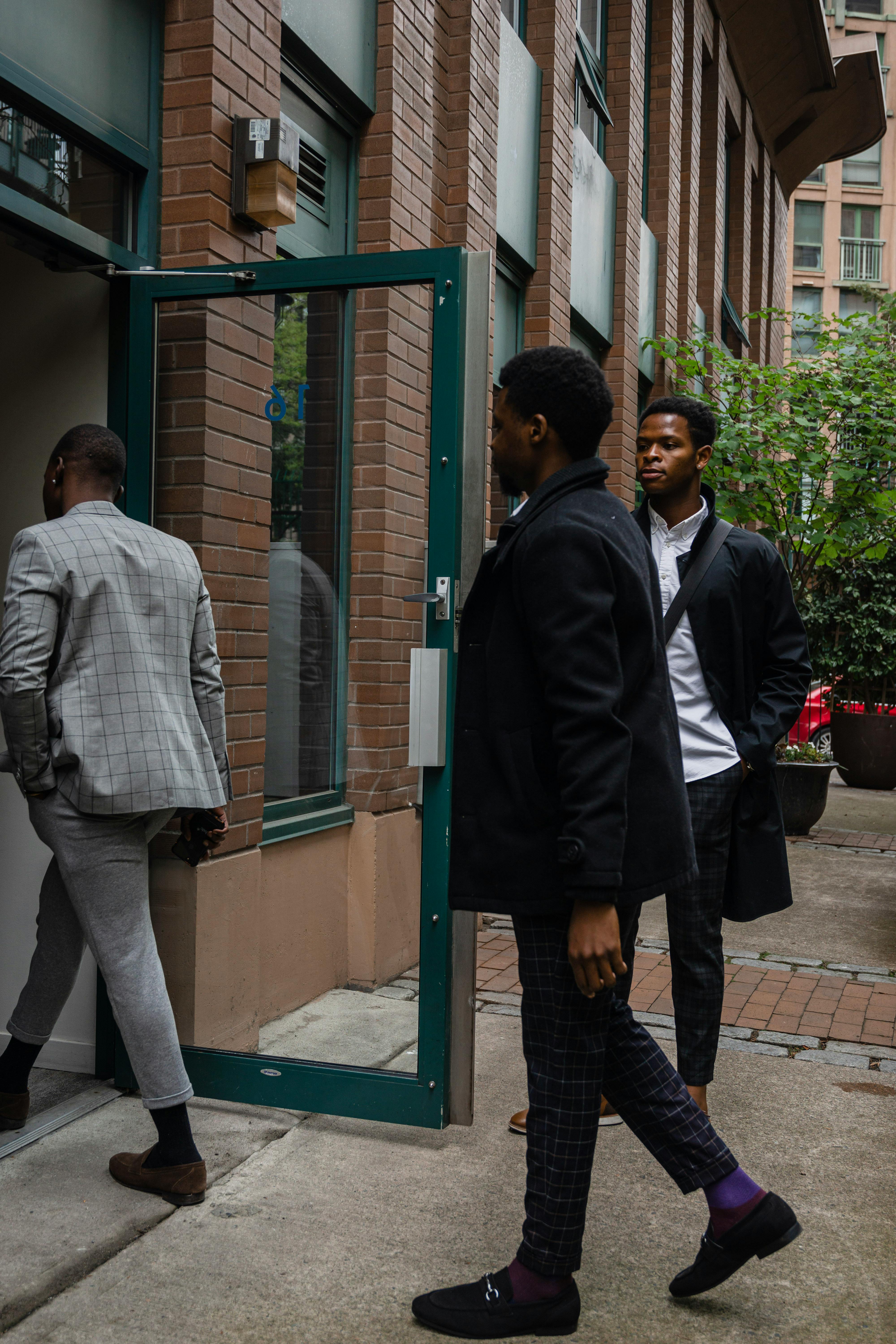 Men Going Inside a Building · Free Stock Photo