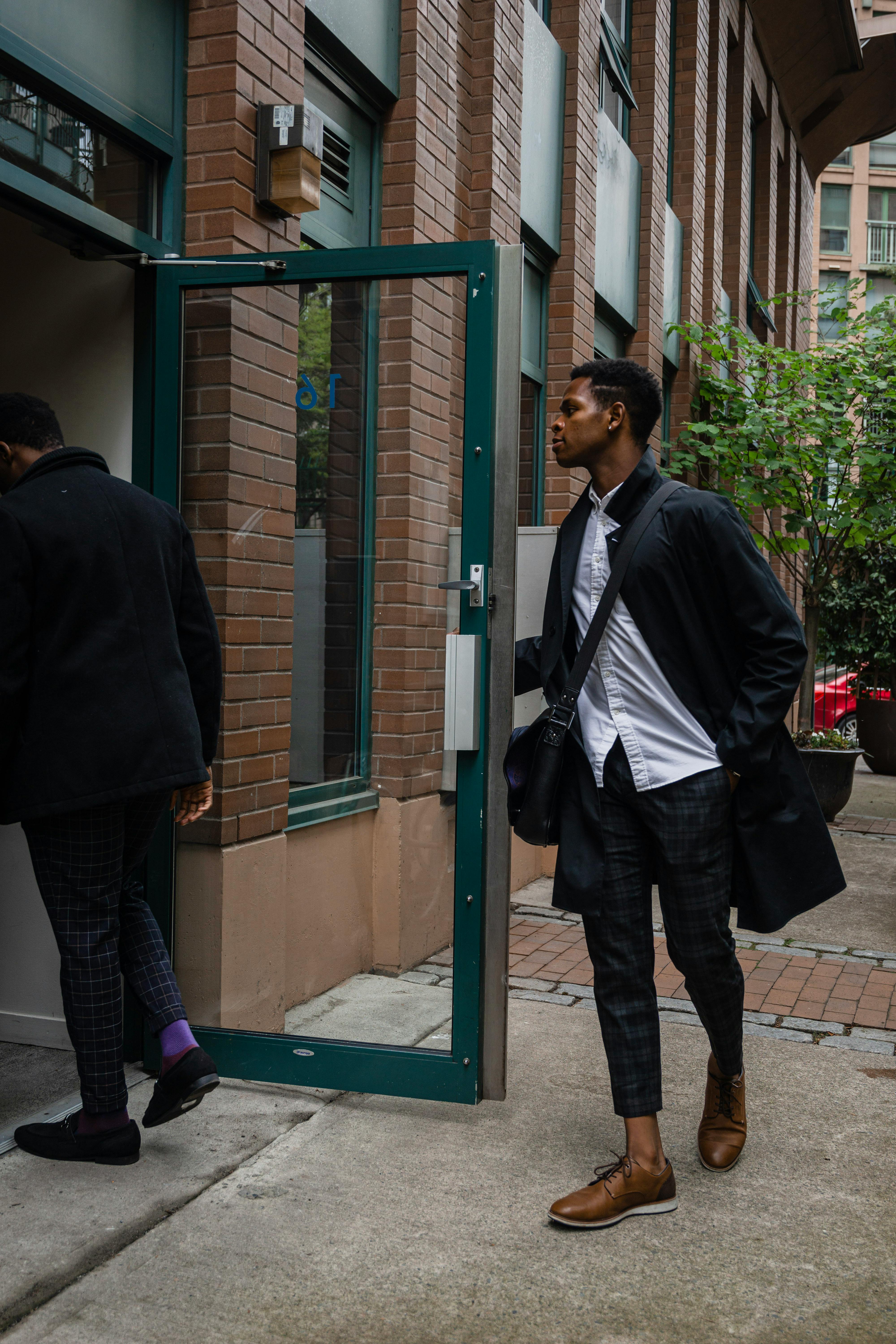 A Man Entering a Building · Free Stock Photo