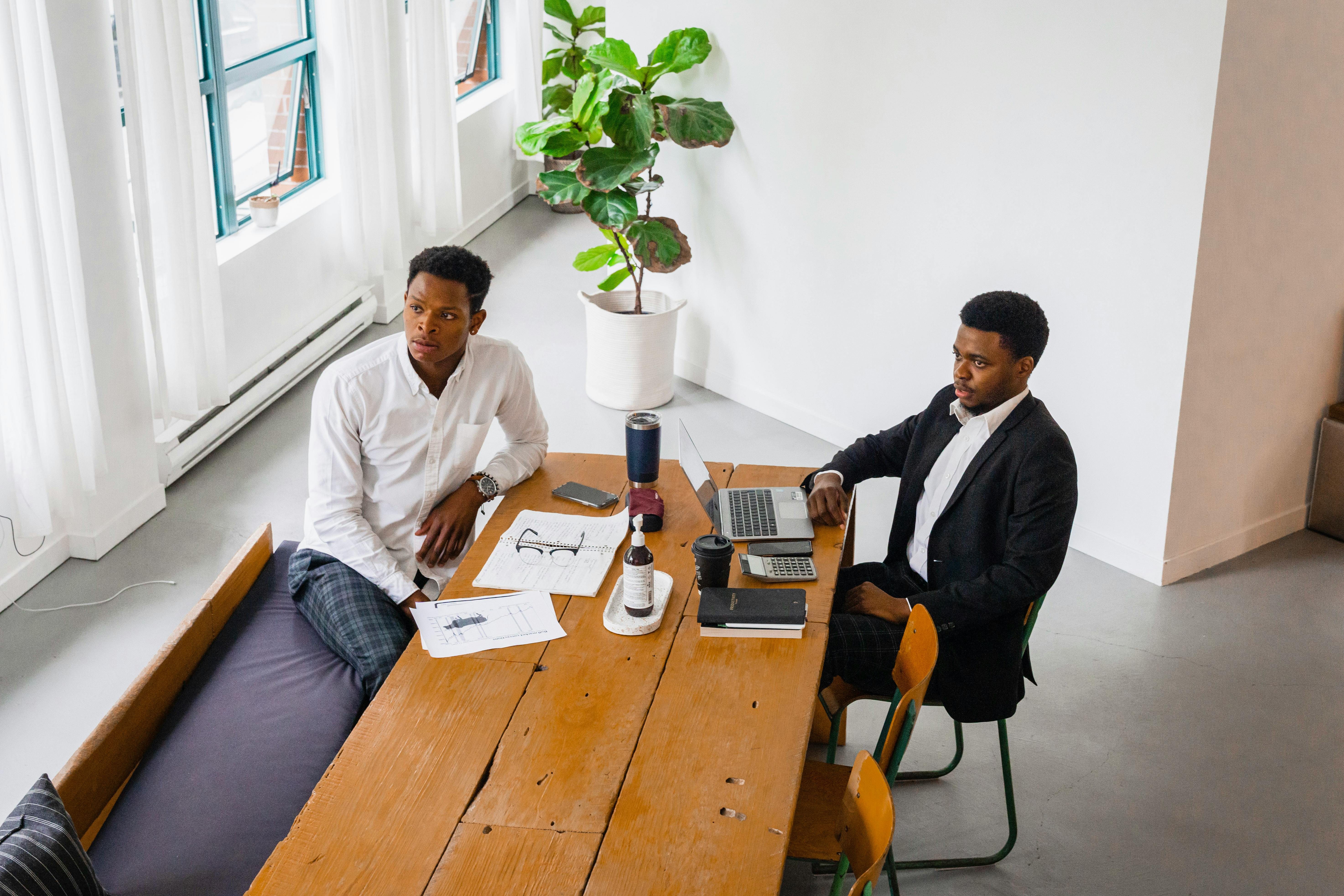 Men Sitting by the Table · Free Stock Photo
