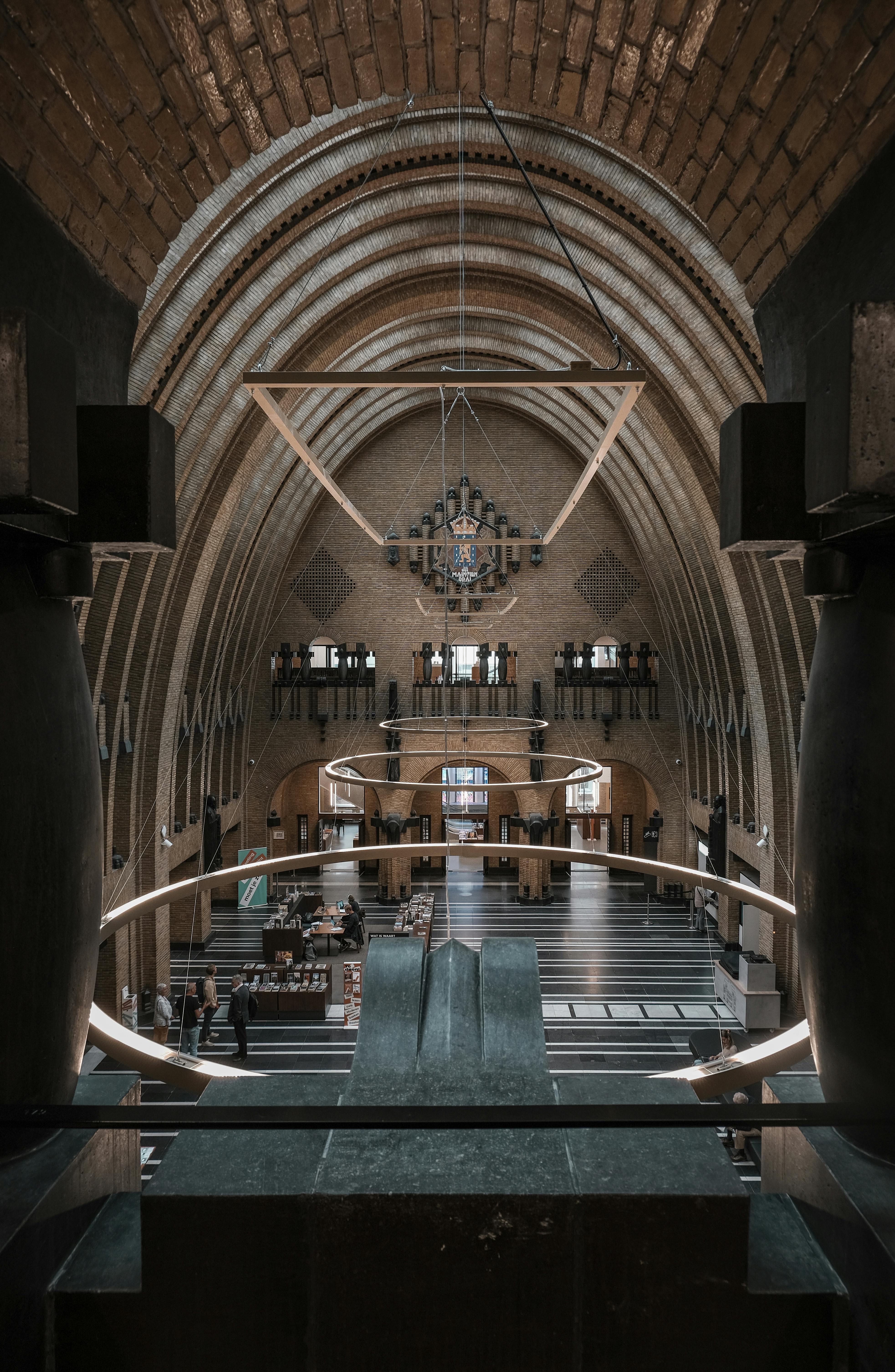 People in Ornamented Building · Free Stock Photo