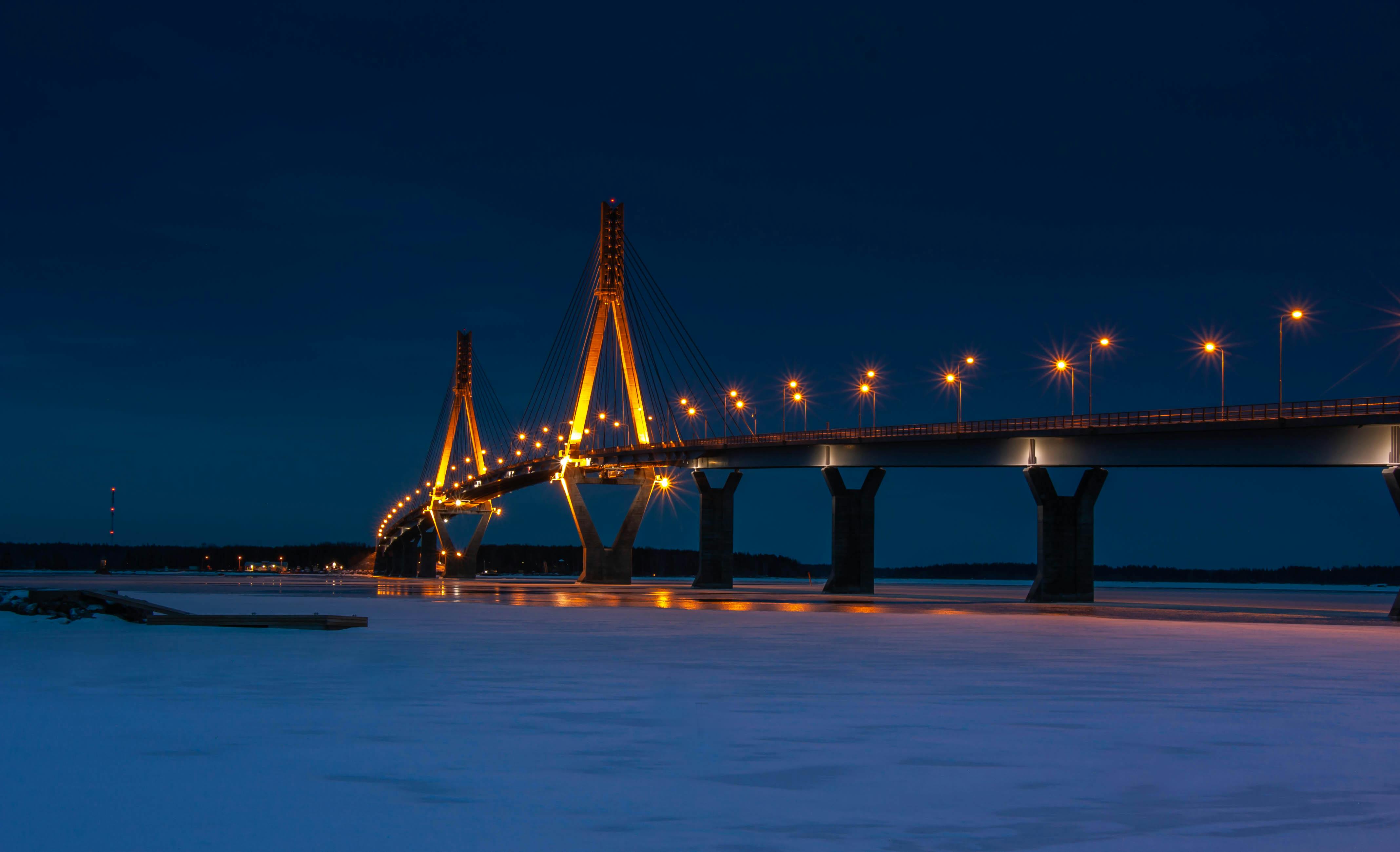 Lighted Bridge over Water during Night Time · Free Stock Photo
