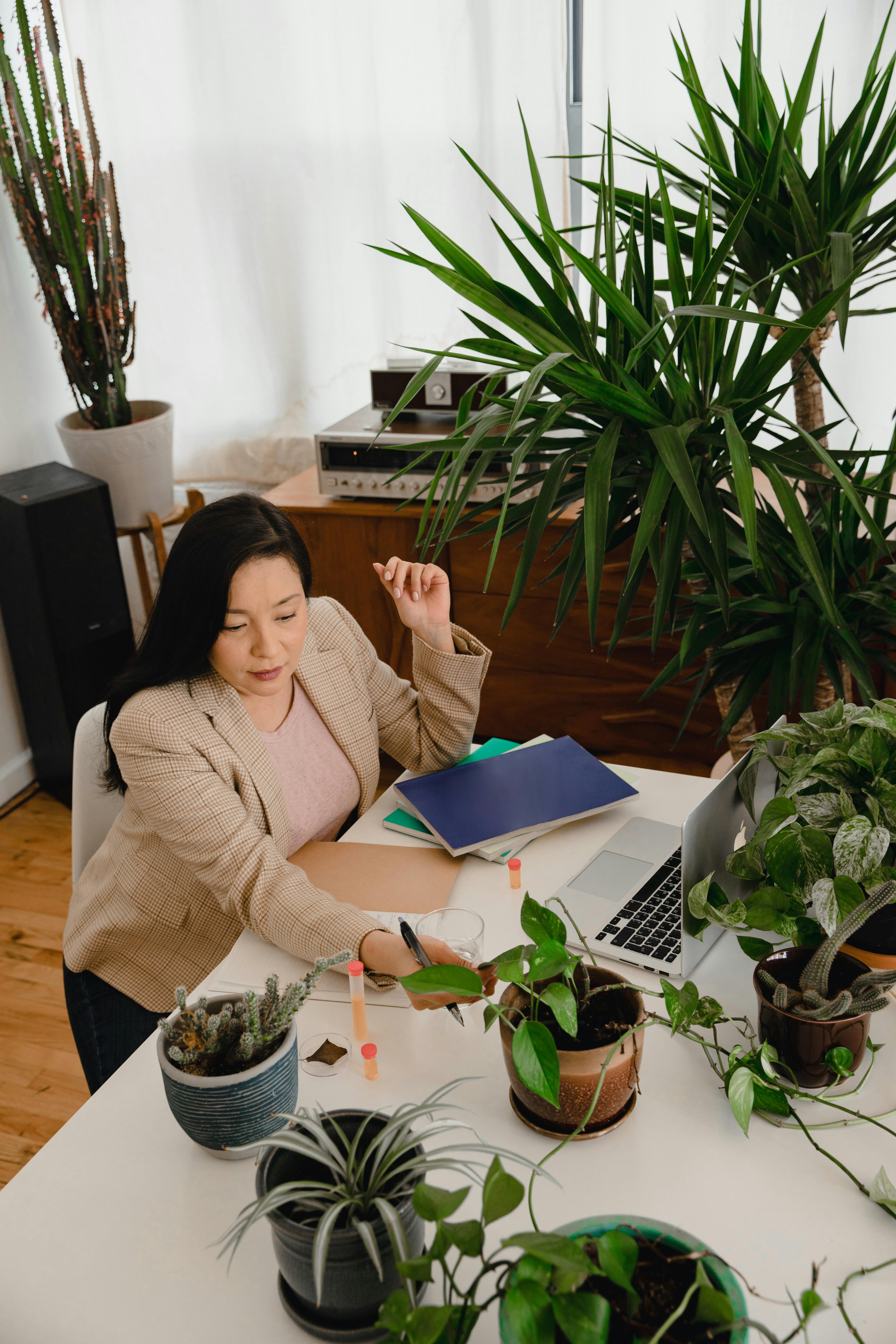 A Woman Sitting at the Table · Free Stock Photo