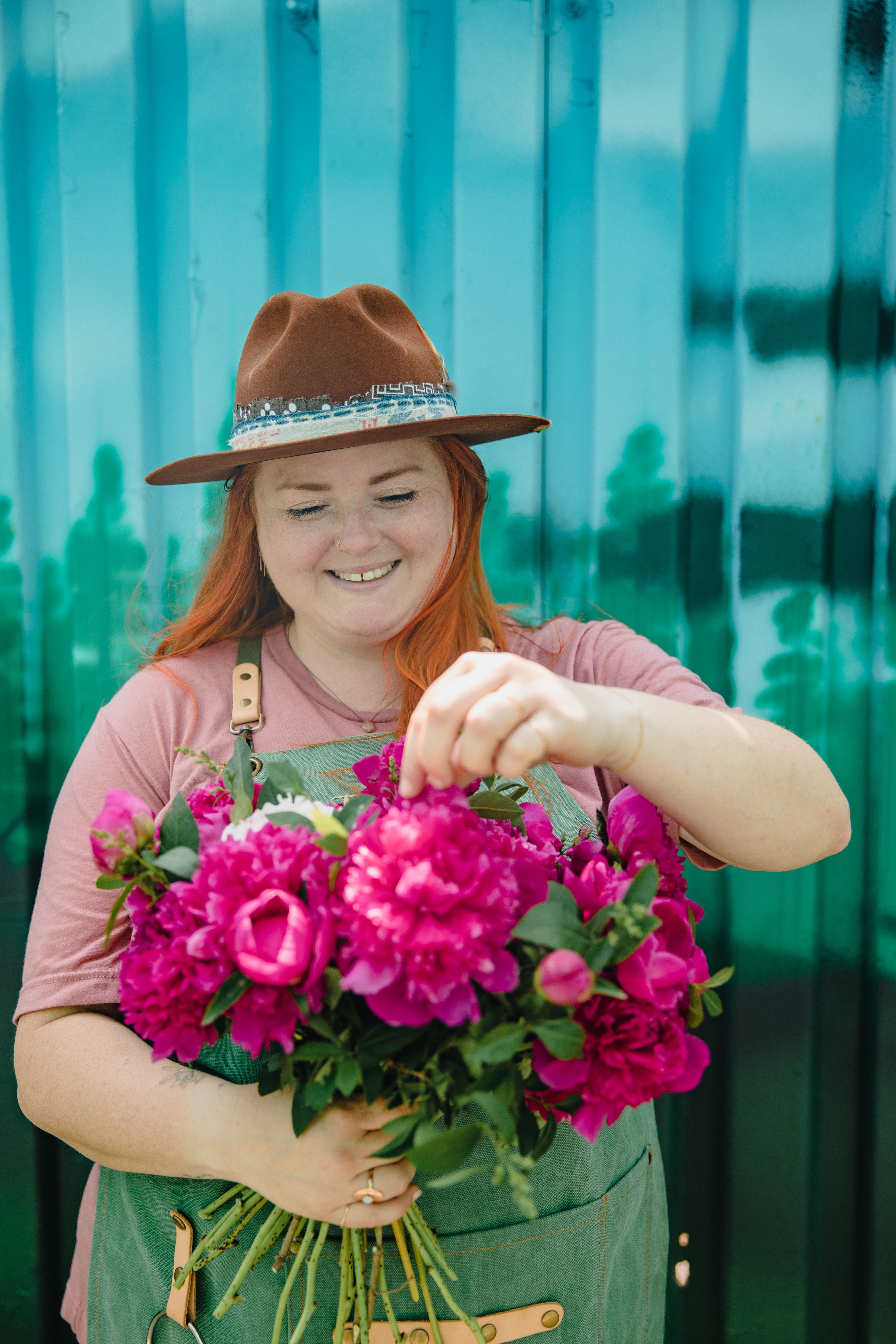 Person Holding Bouquet of Flowers While Hugging a Woman · Free Stock Photo
