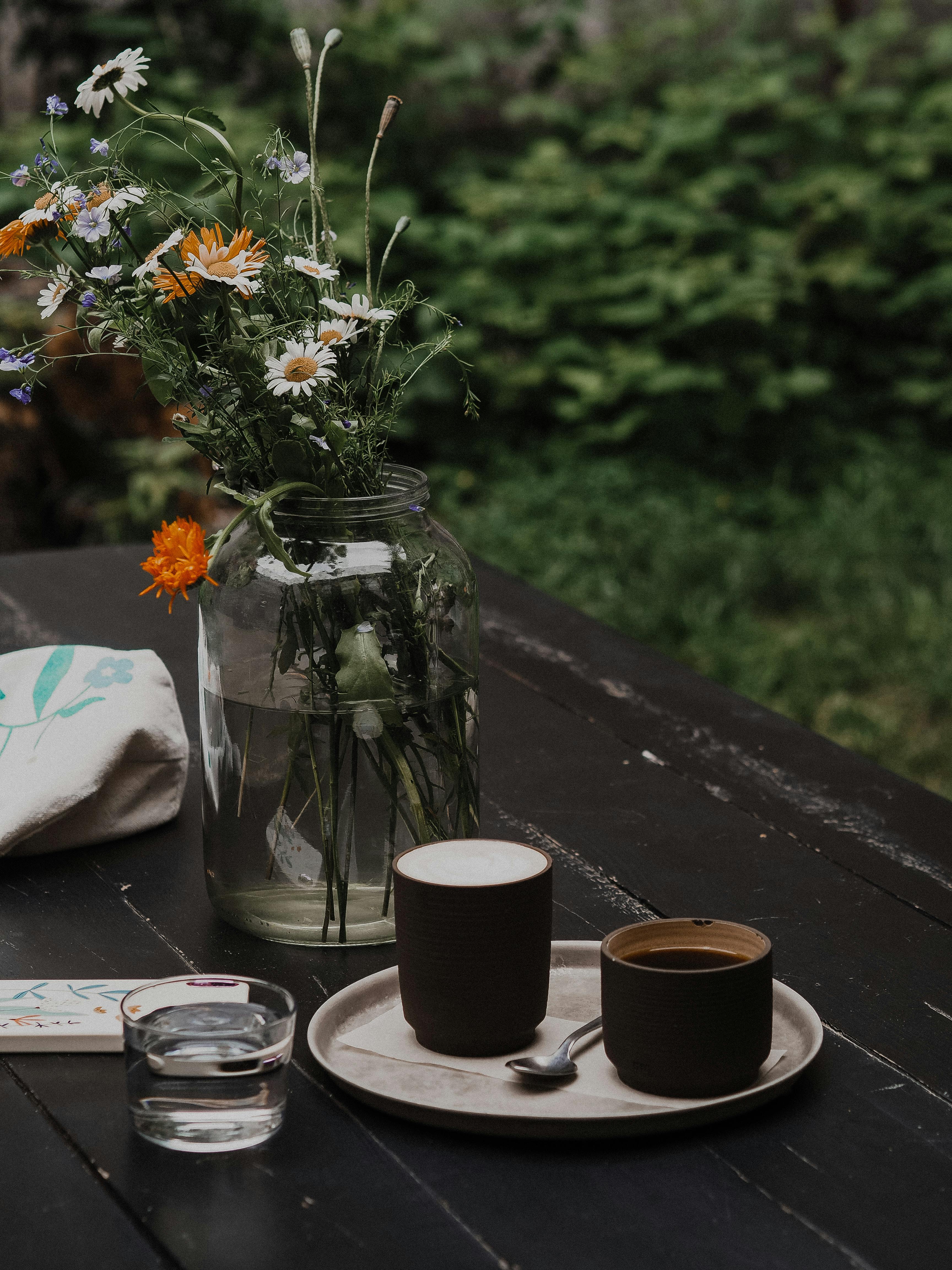 Yellow Flowers in a Glass Jar · Free Stock Photo