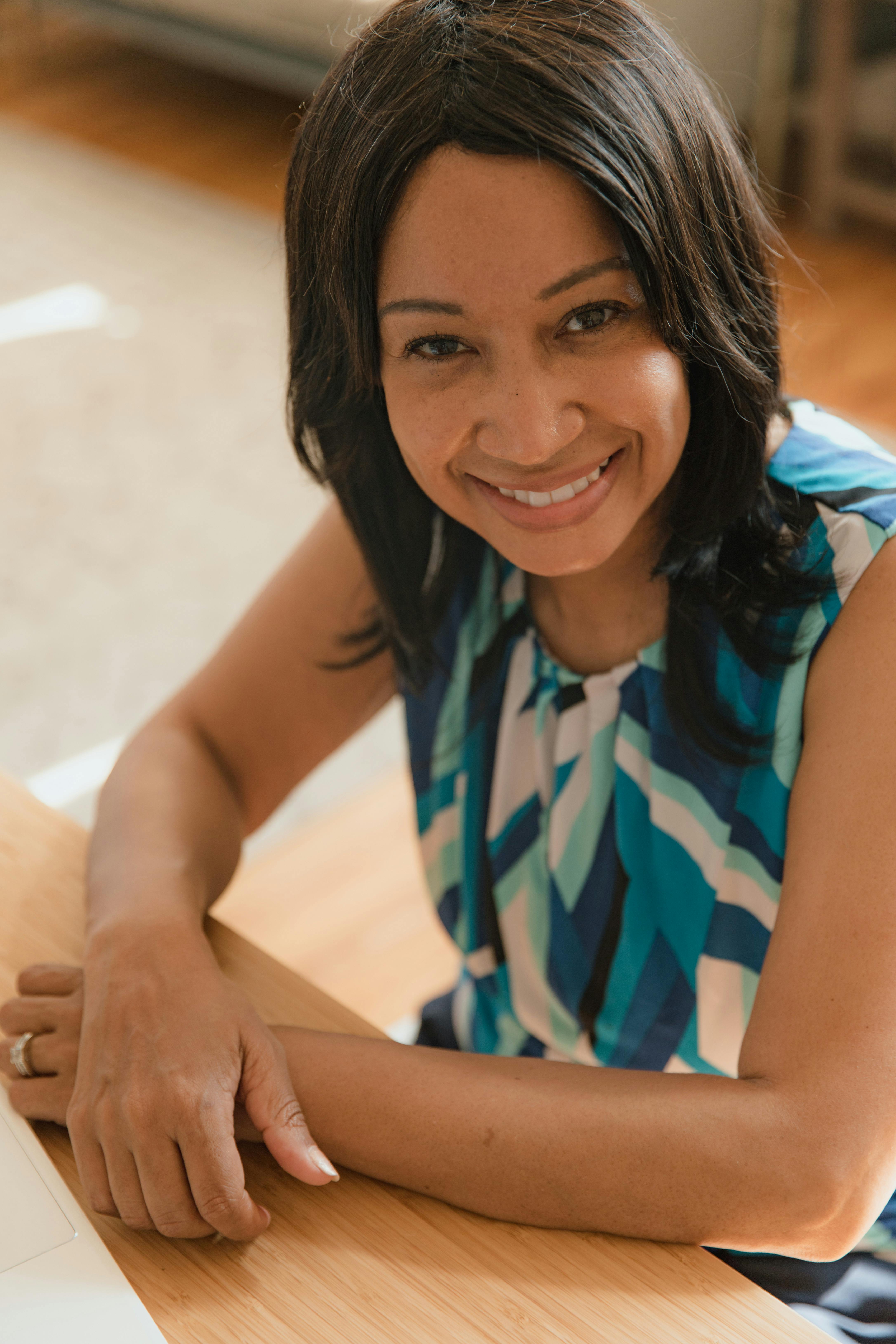 A Woman Smiling at the Camera · Free Stock Photo