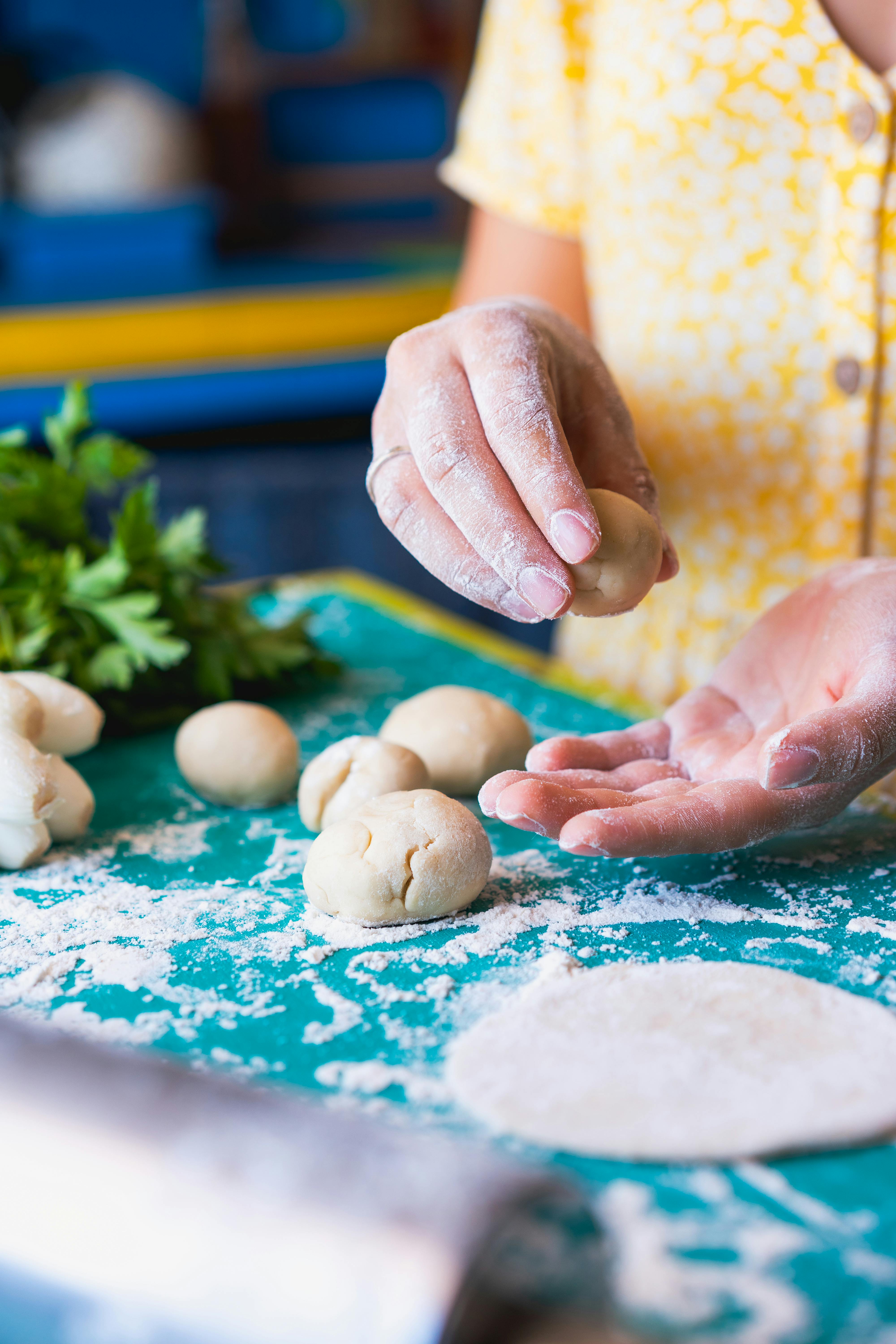 Man and a Girl Kneading Flour on a White Surface · Free Stock Photo