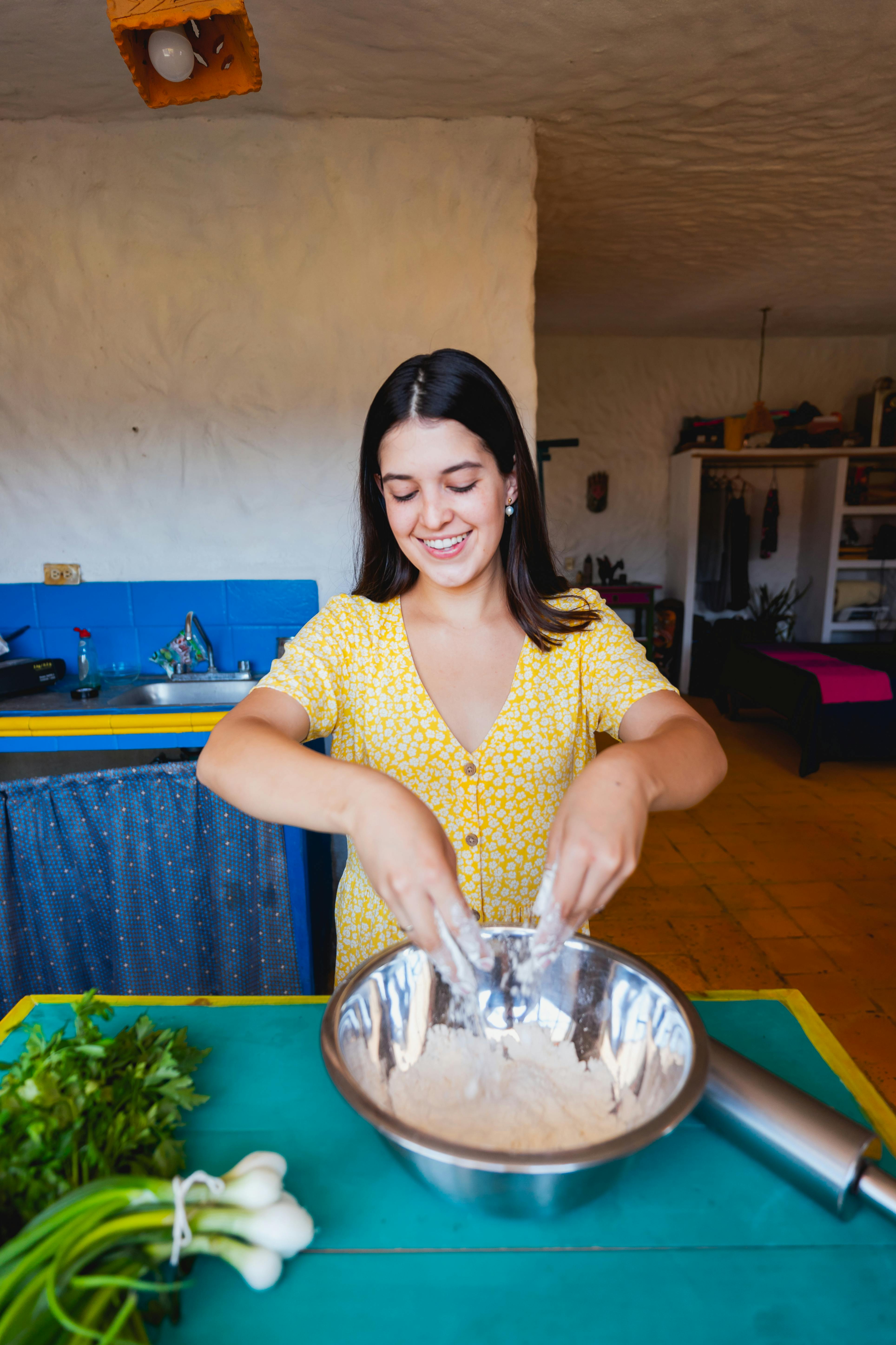 A Woman Standing Near the Table · Free Stock Photo