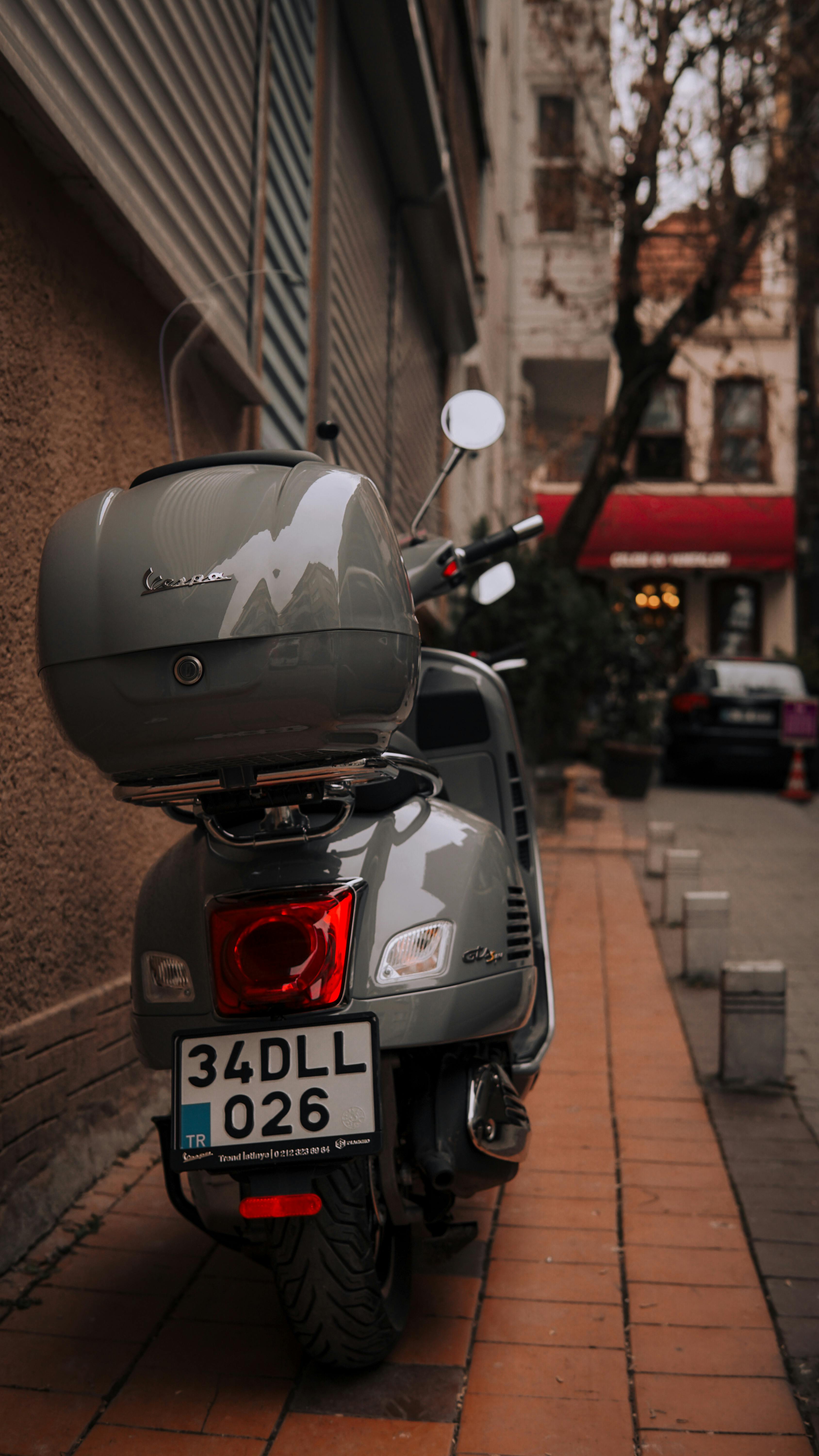 Photo of Brown and White Motor Scooted Parked Near Window · Free Stock ...