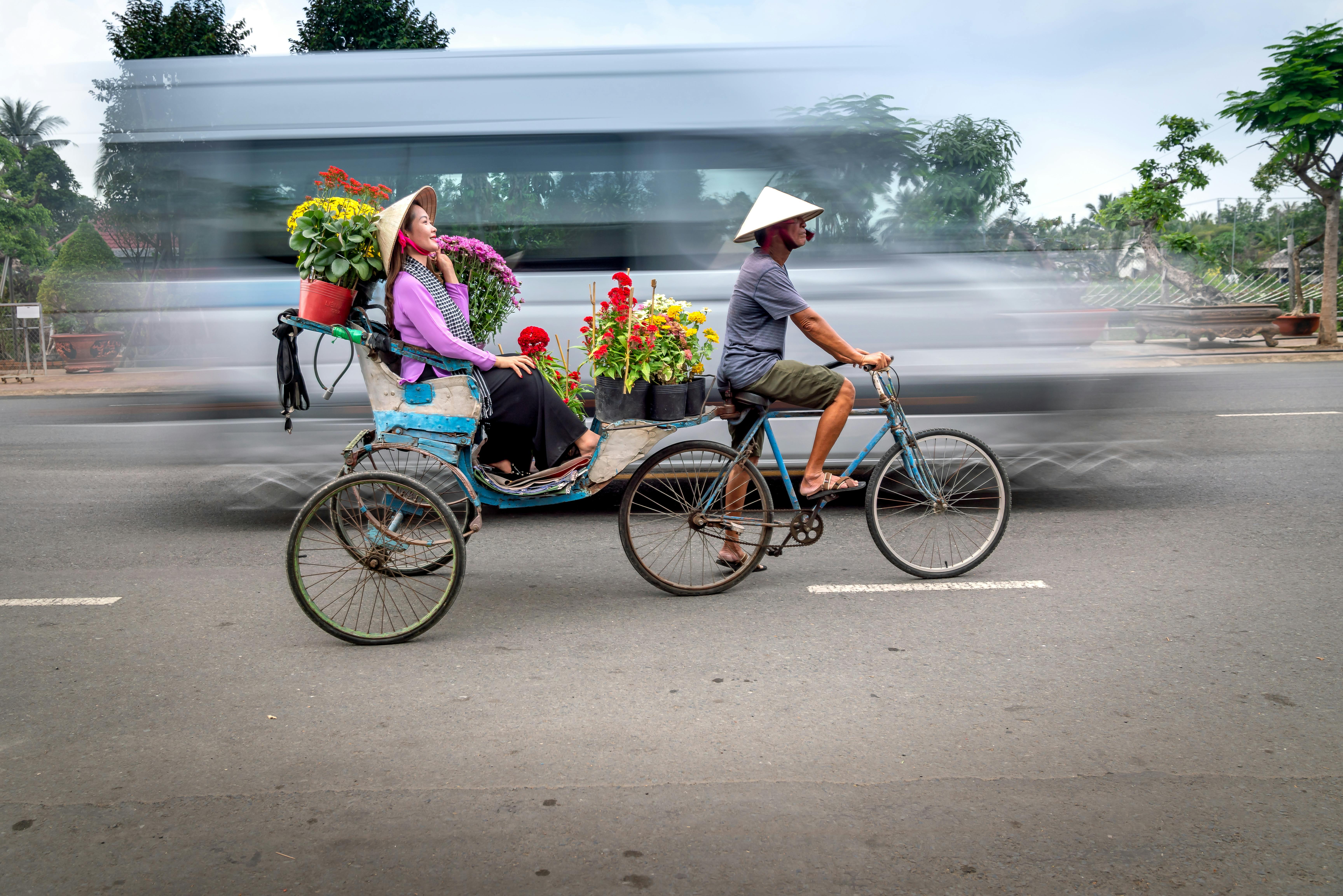 A Woman Riding a Rickshaw · Free Stock Photo