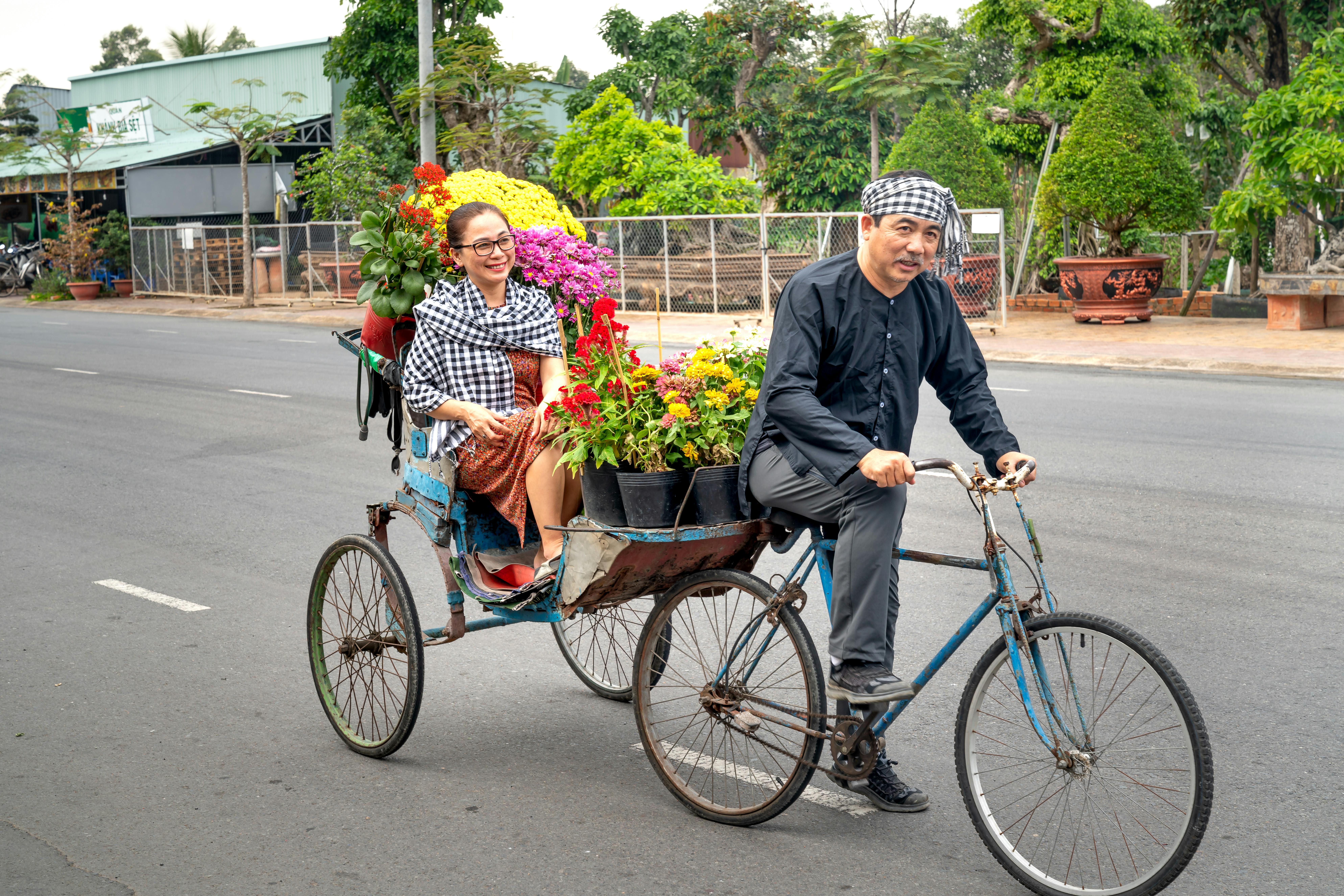 A Woman Riding a Rickshaw · Free Stock Photo