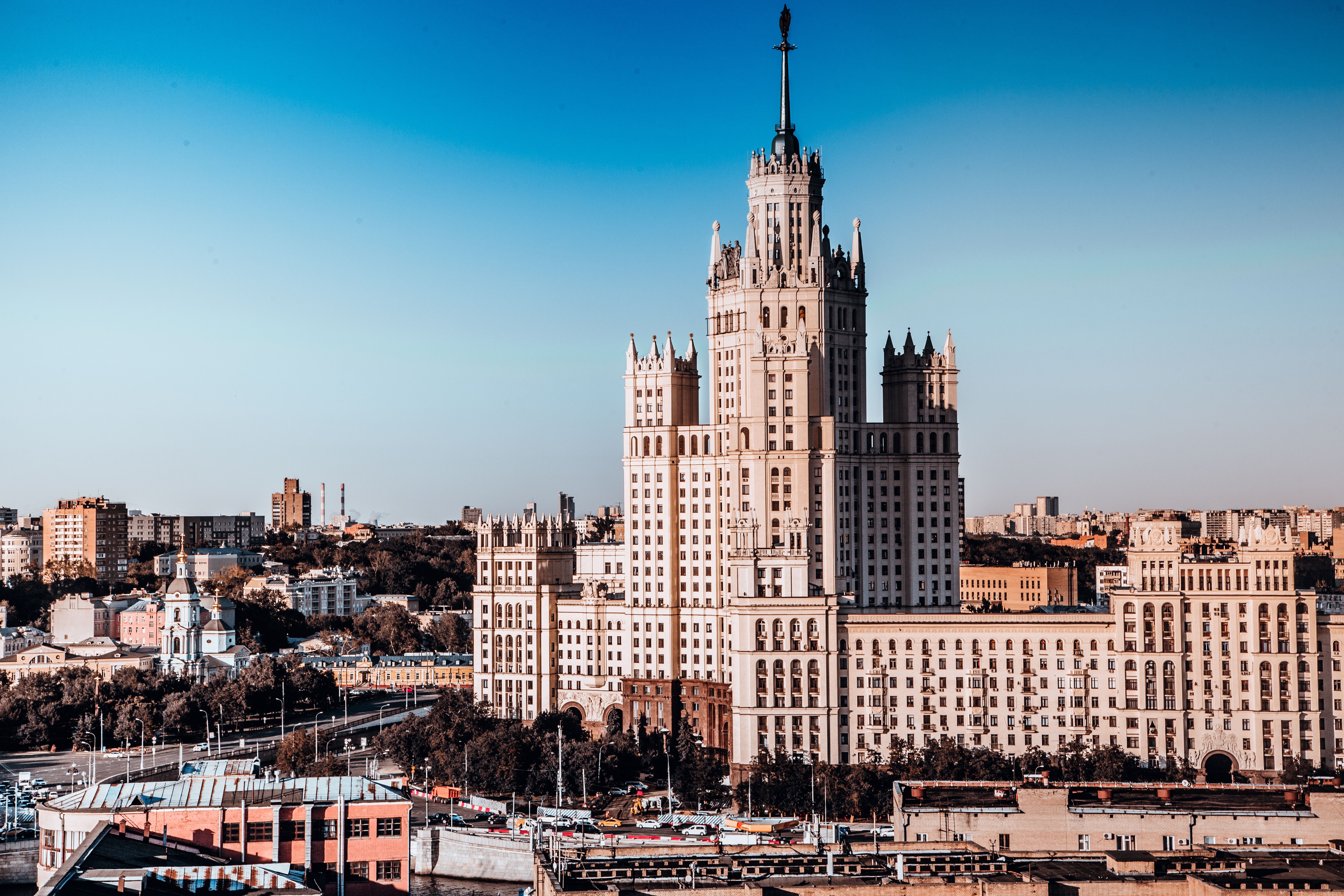 A Concrete Building with a Spire on Tower · Free Stock Photo