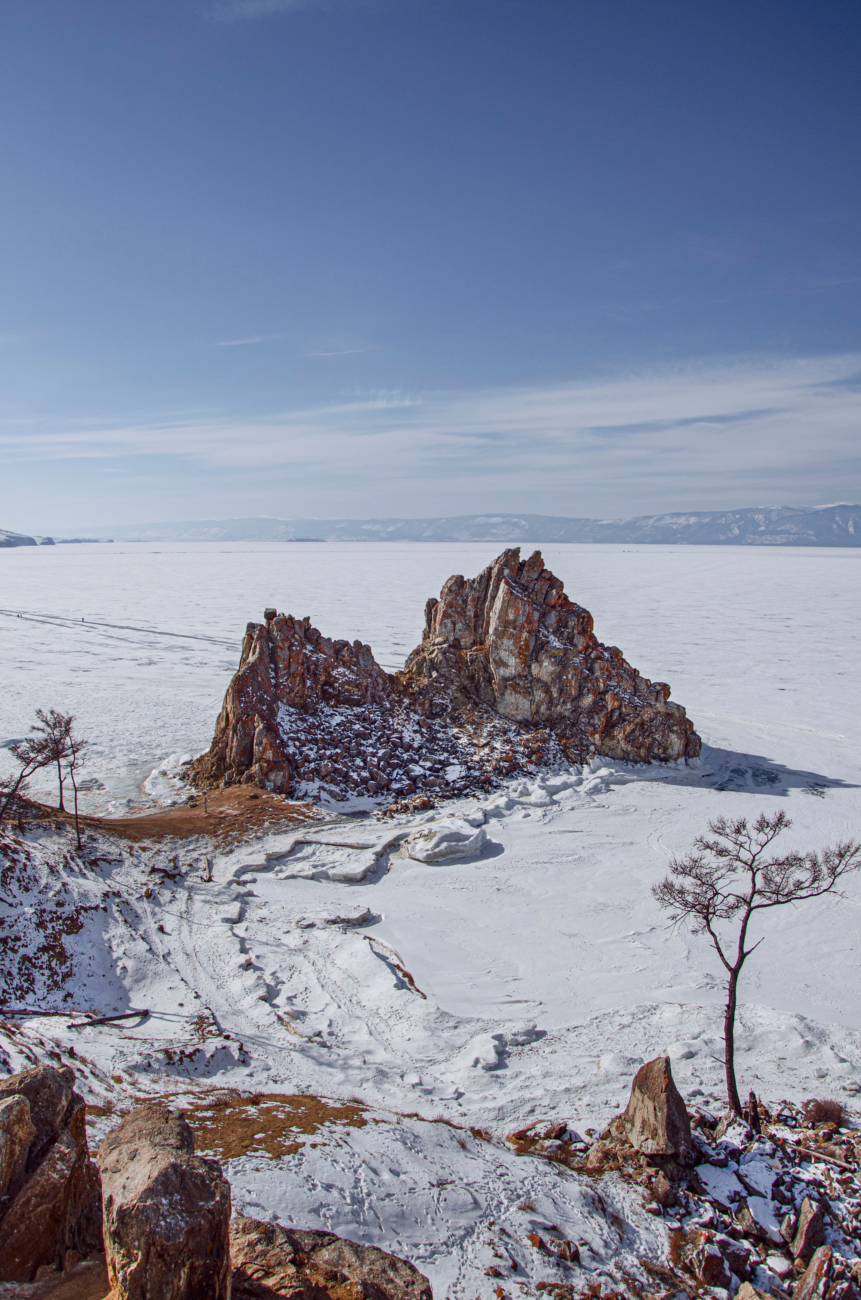 A Rock Formation on Snow Covered Ground · Free Stock Photo