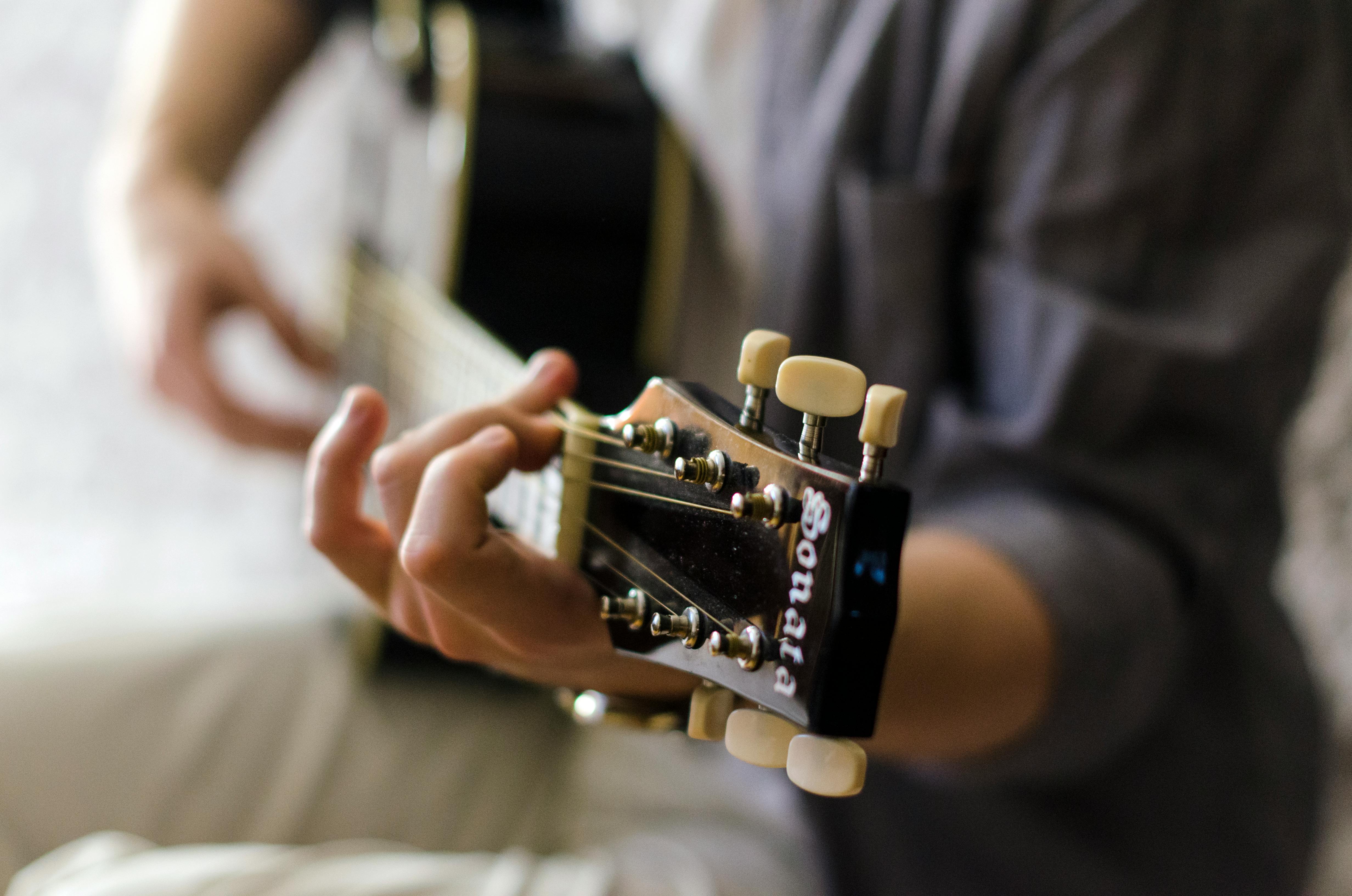 Photo of Person Playing the Guitar · Free Stock Photo