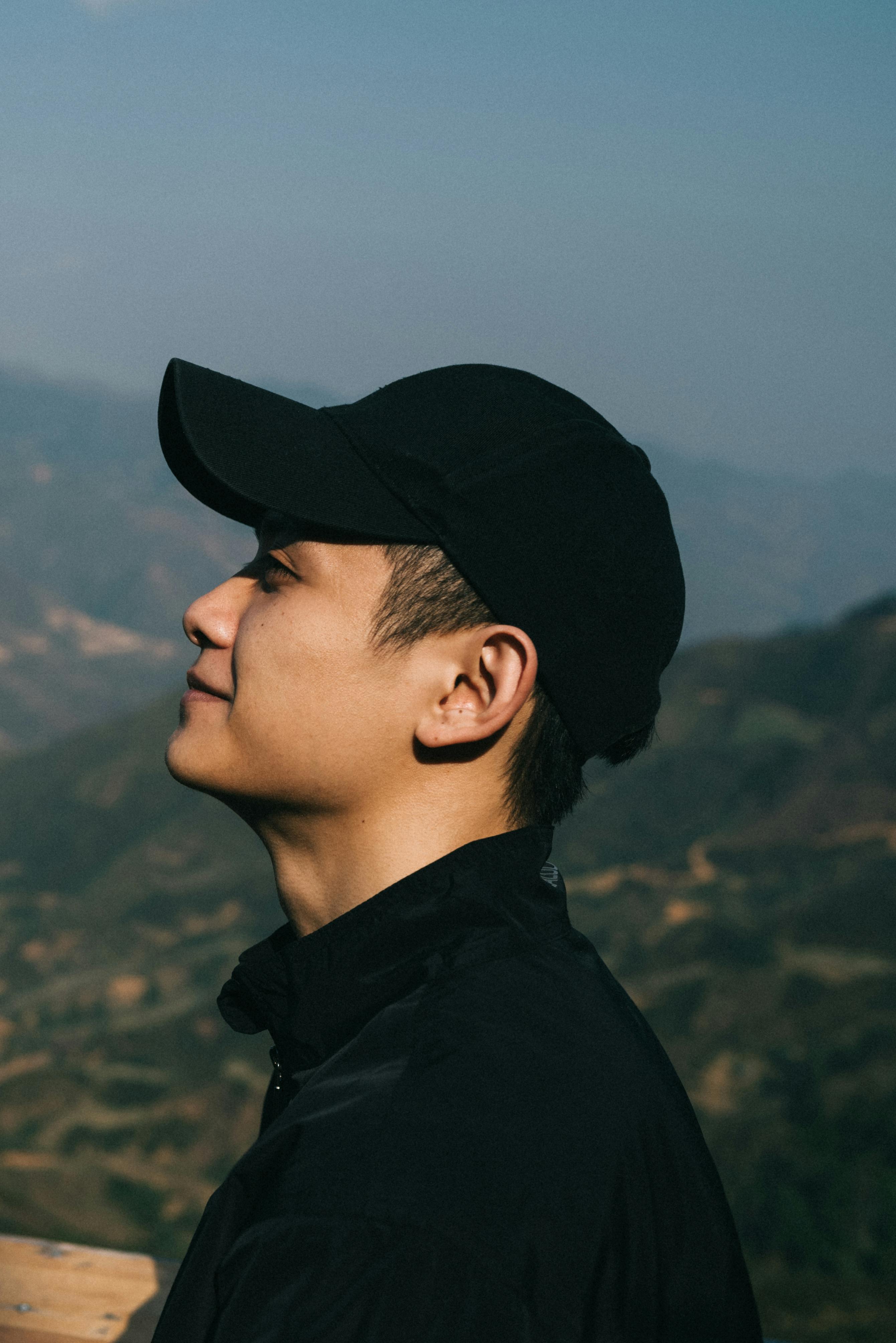 A Side View of a Man Wearing Red Cap · Free Stock Photo