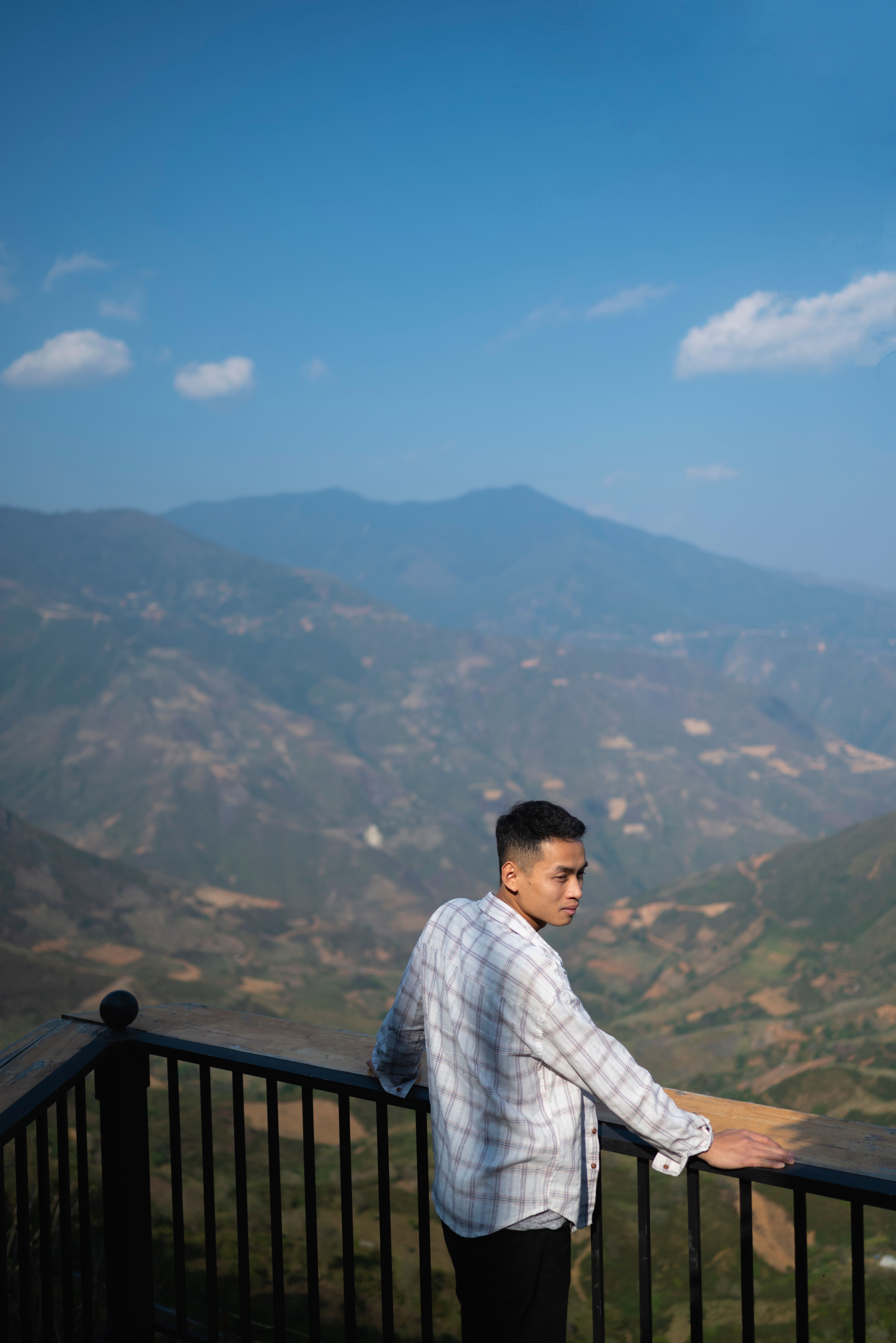 Man Standing on Balcony in Mountains · Free Stock Photo