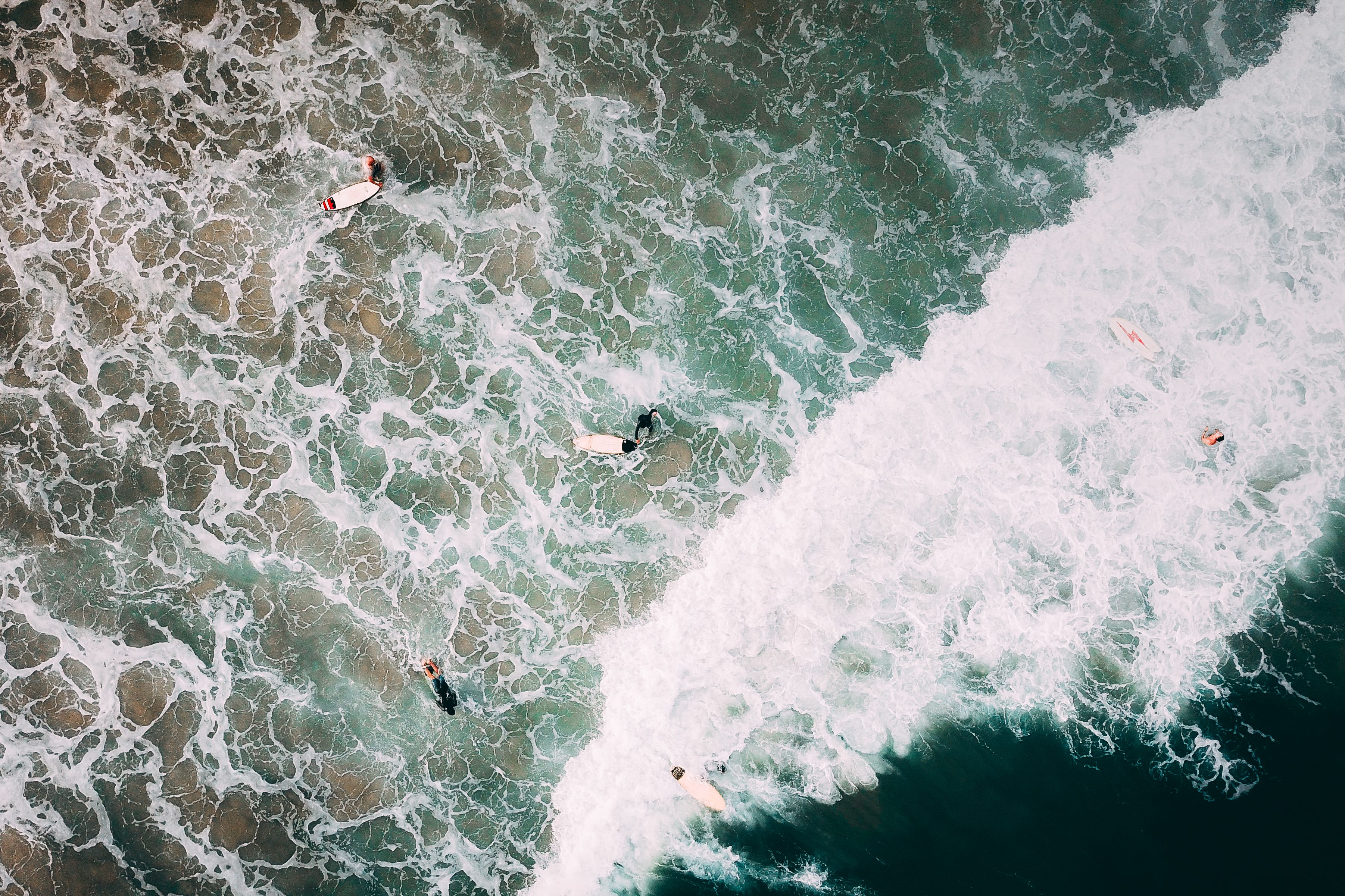 Aerial View Of People Surfing On Sea Waves · Free Stock Photo