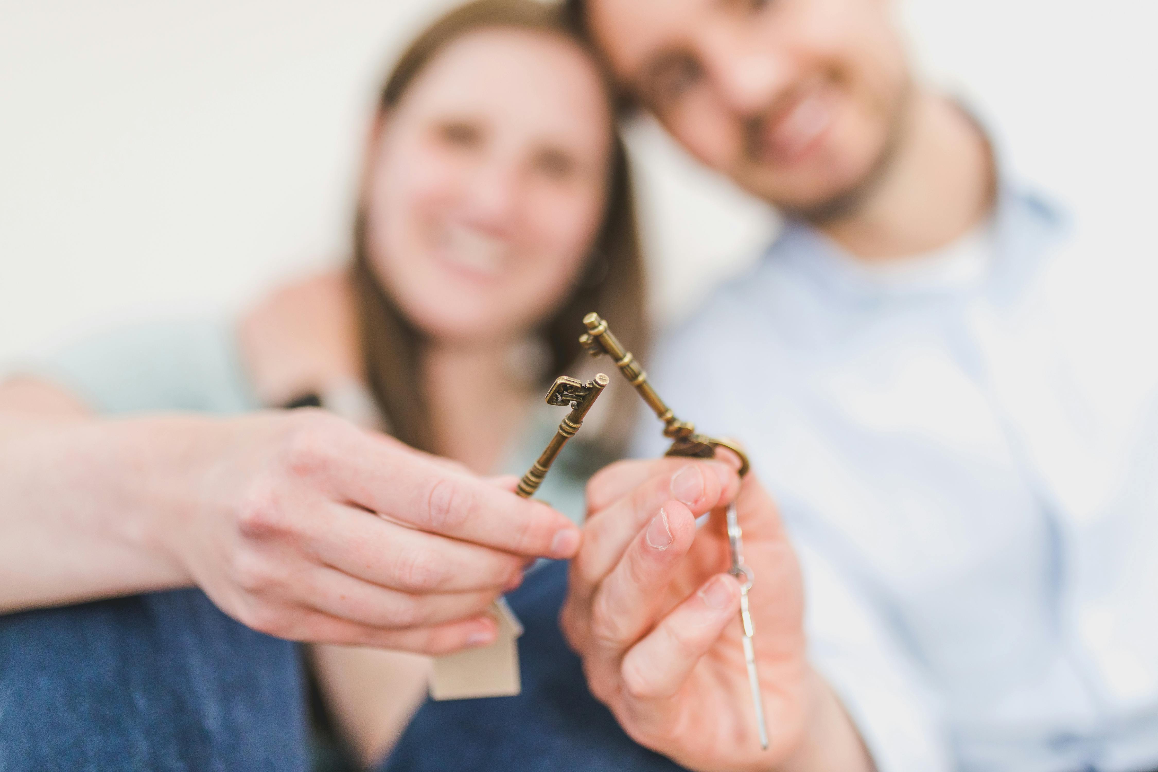 A Couple Holding their Keys · Free Stock Photo