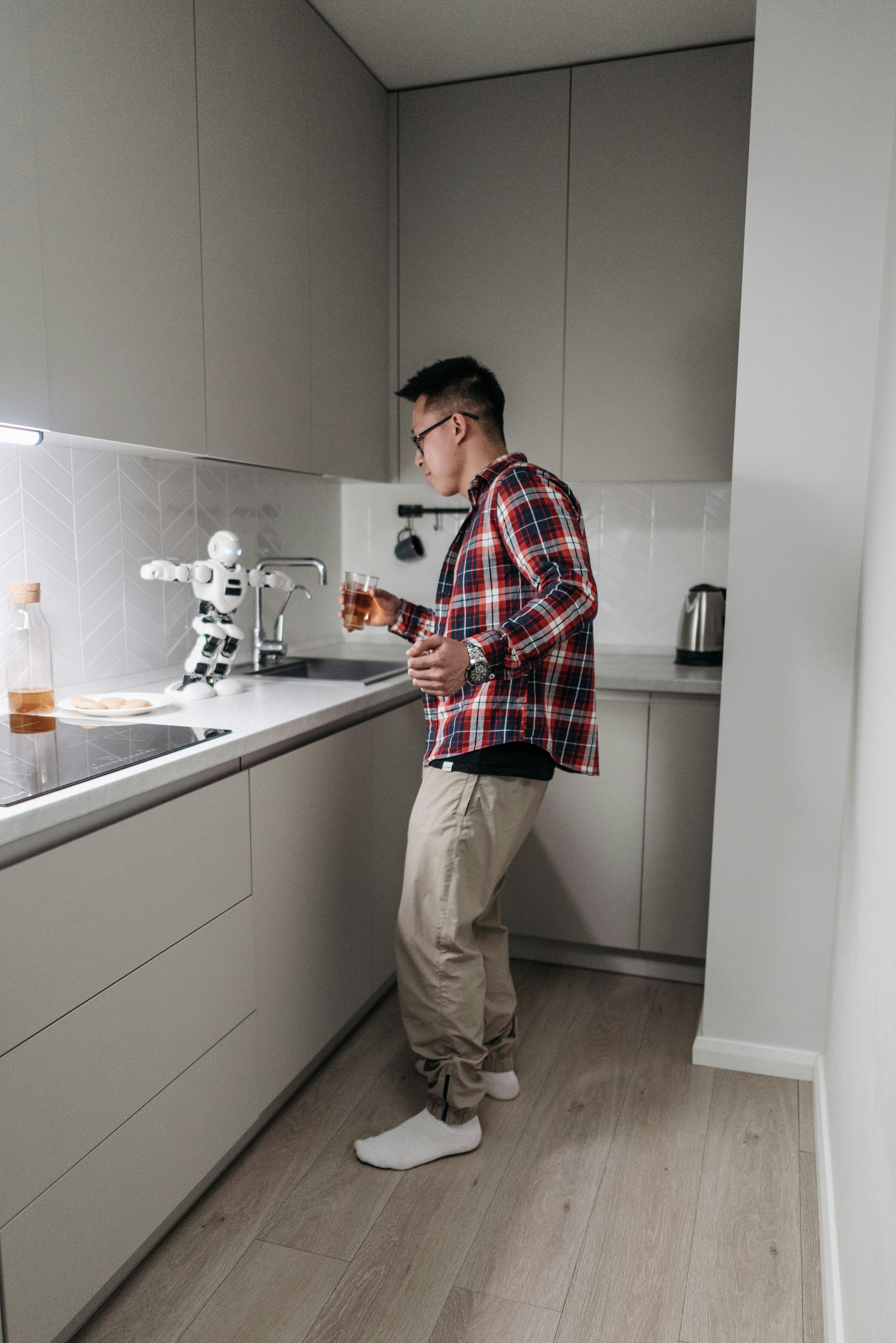A Man Standing in the Kitchen · Free Stock Photo