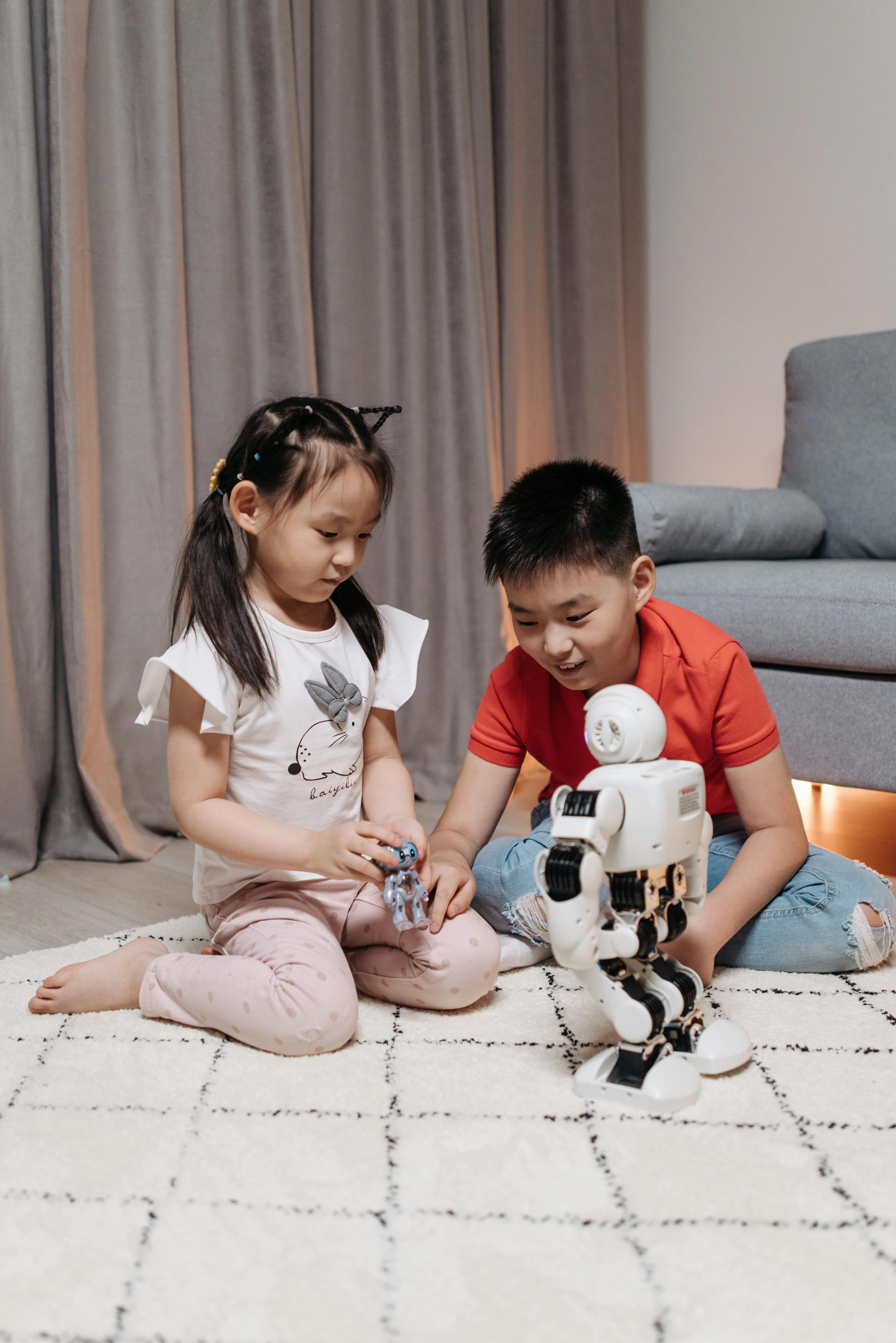 Kids Playing the White Robot Together · Free Stock Photo