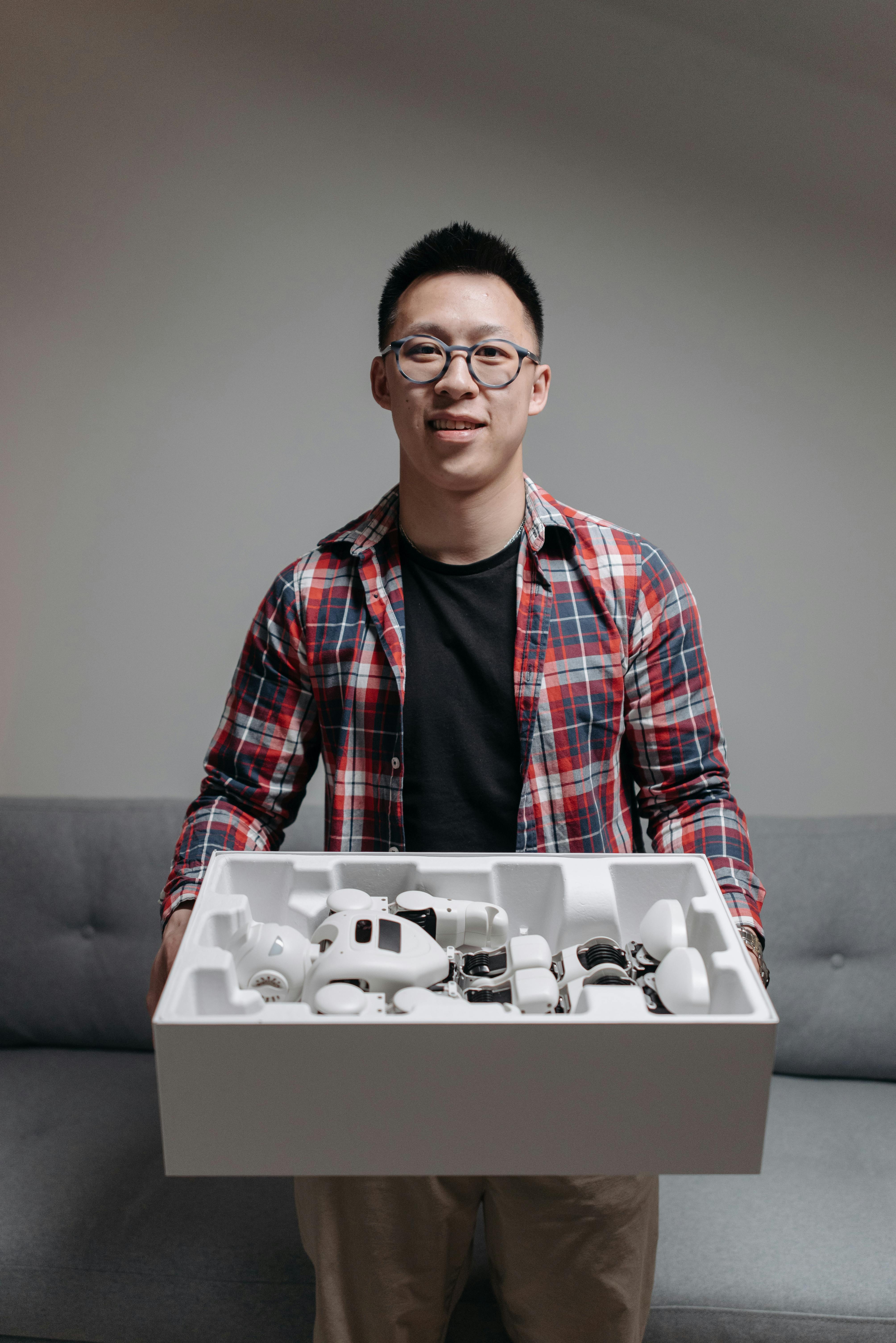 A Man Holding a Box · Free Stock Photo