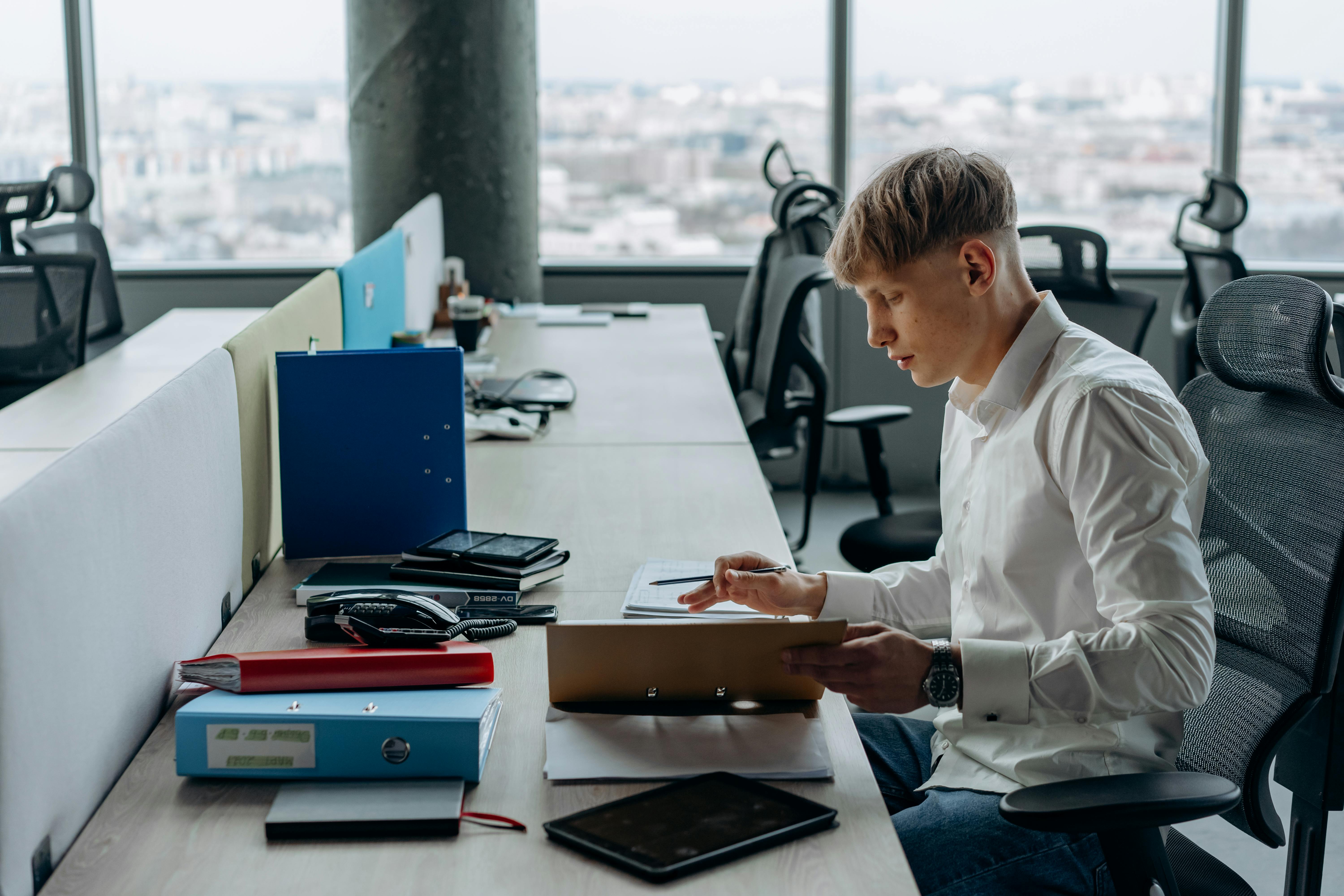 A Man Working Inside an Office · Free Stock Photo