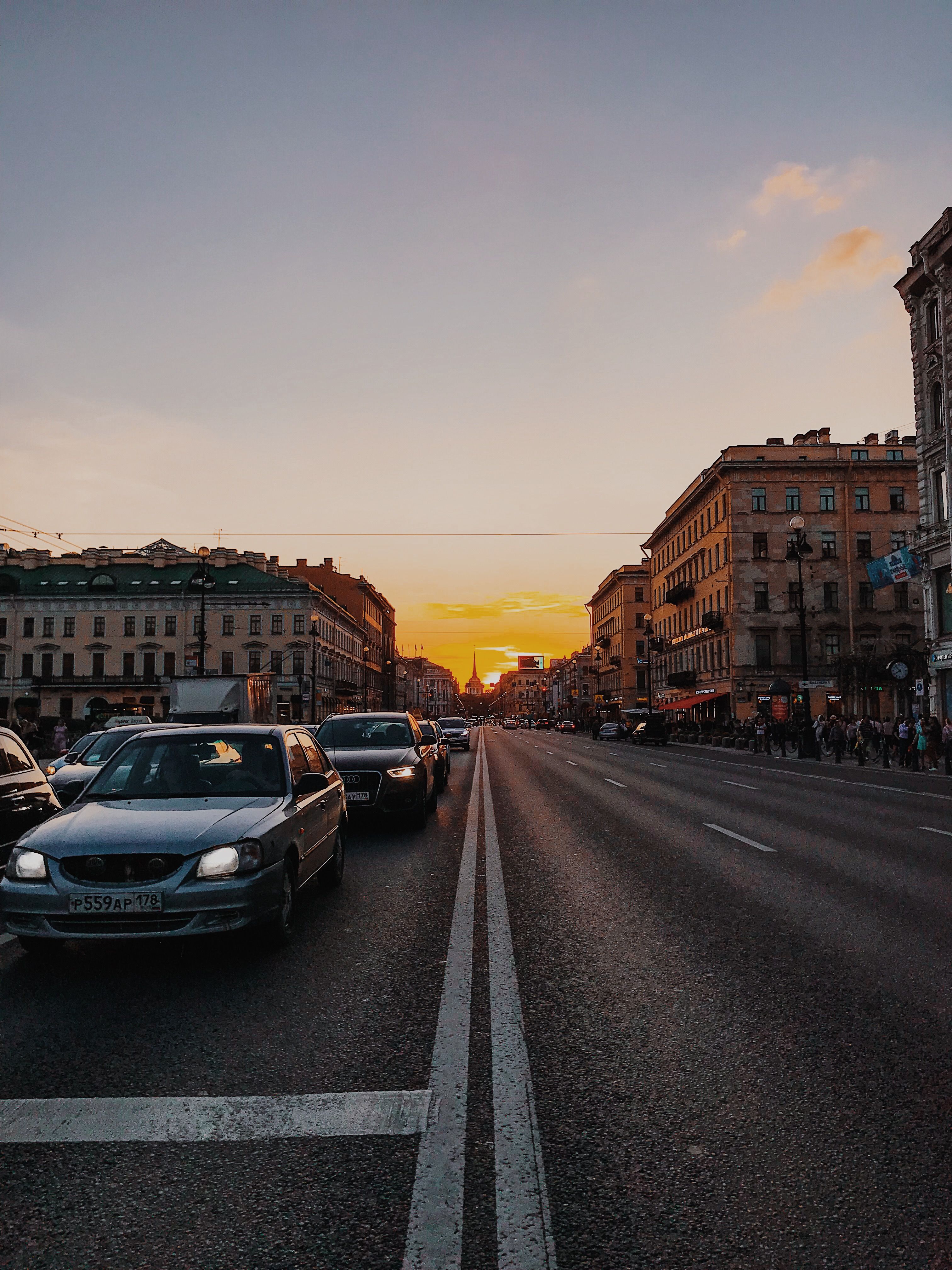Cars Parked on Gray Asphalt Road during Sunset · Free Stock Photo