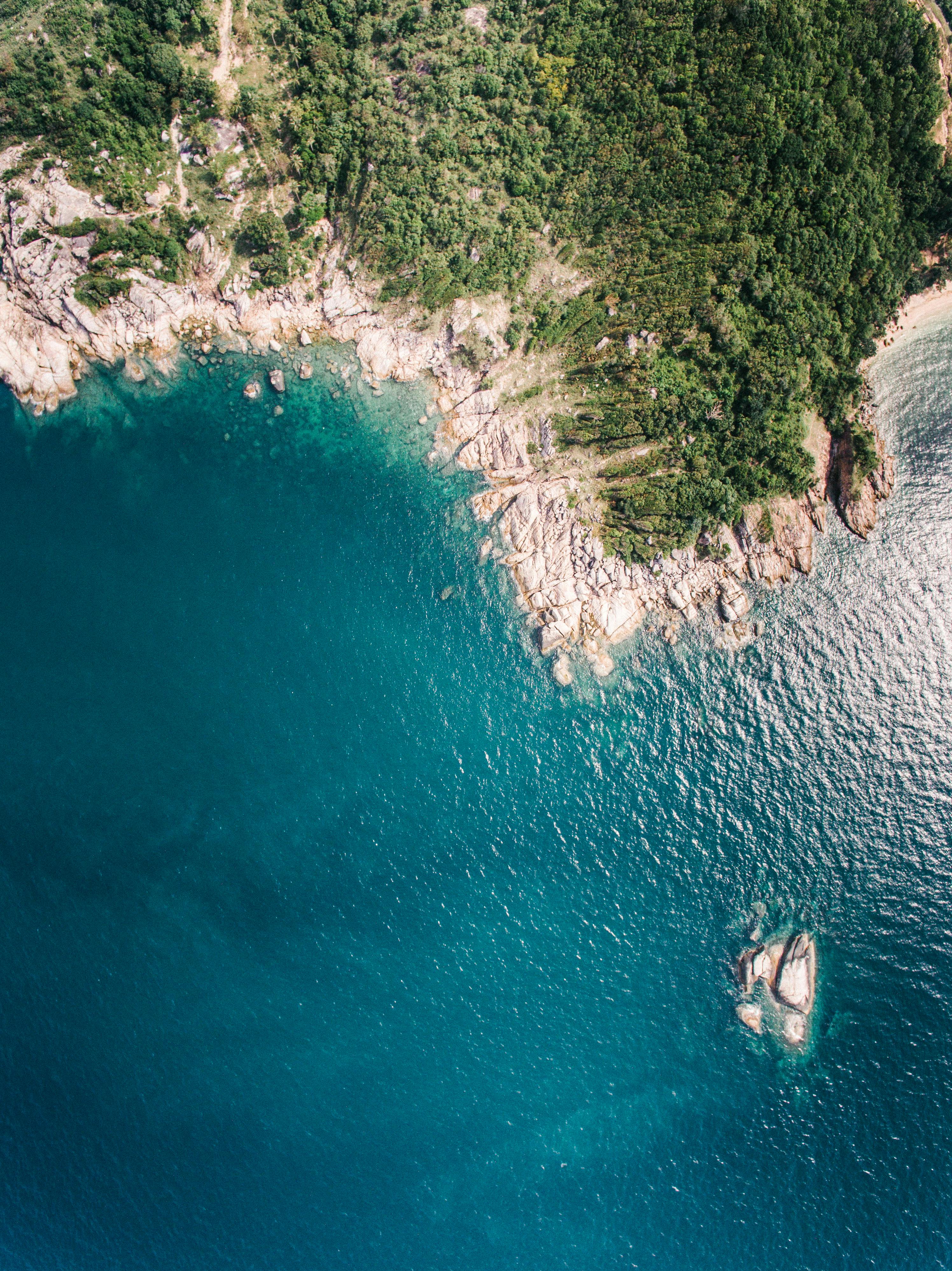 Aerial Photography of Brown and Green Mountain near Ocean · Free Stock ...