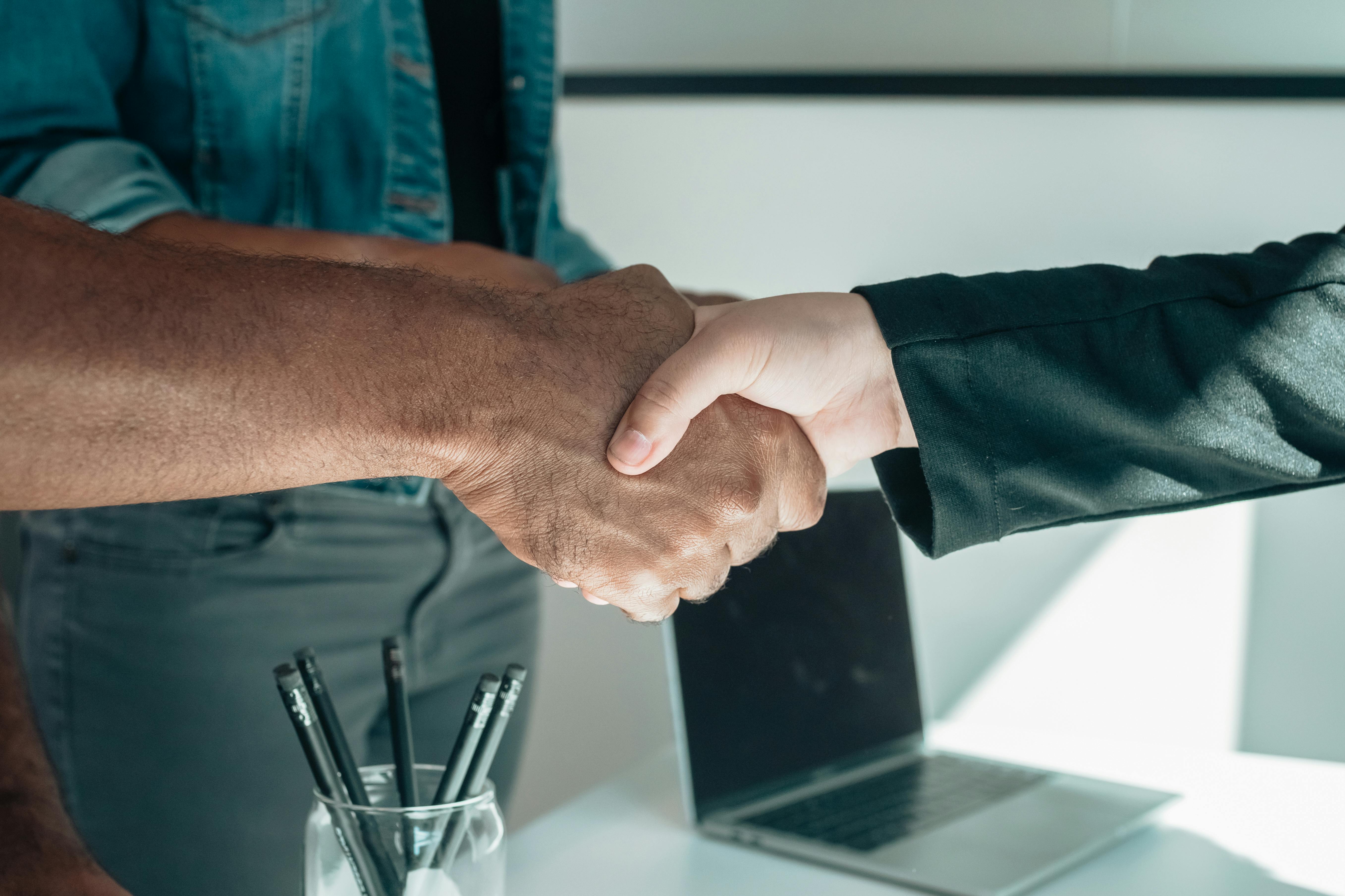 Close-Up Shot of a Handshake · Free Stock Photo