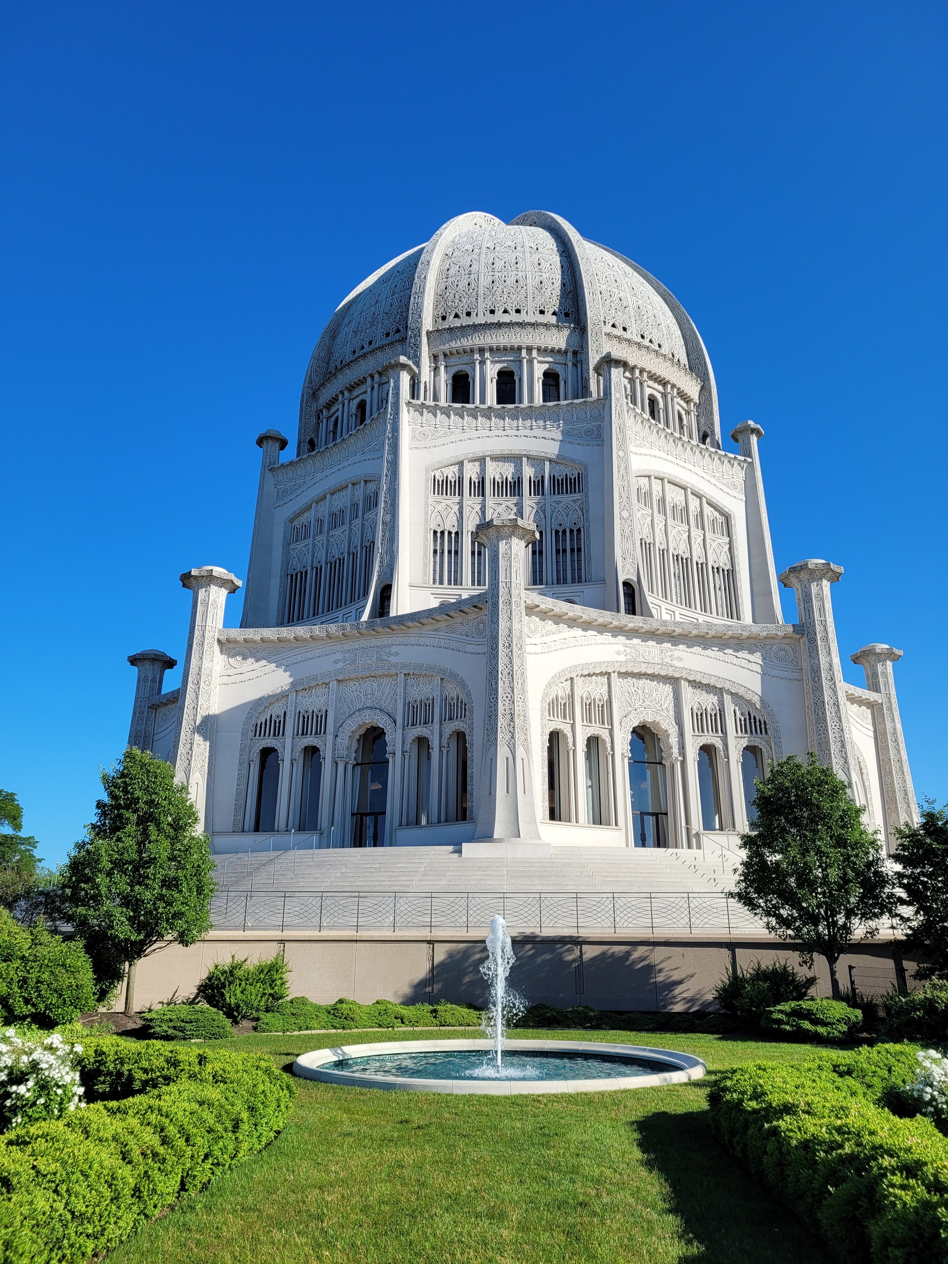 A Low Angle Shot of a Concrete Temple Under the Blue Sky · Free Stock Photo