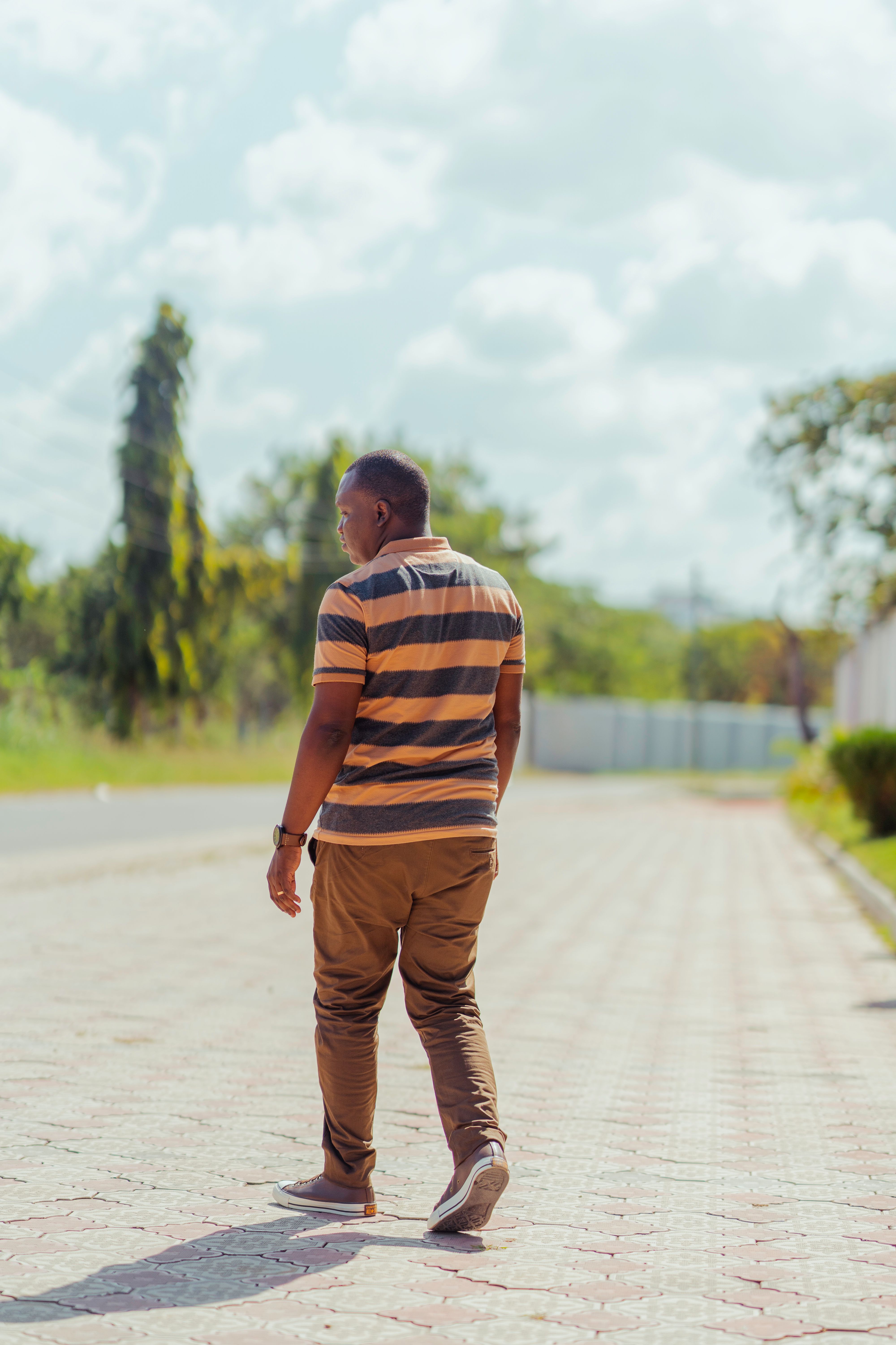 Man Walking on a Boardwalk · Free Stock Photo