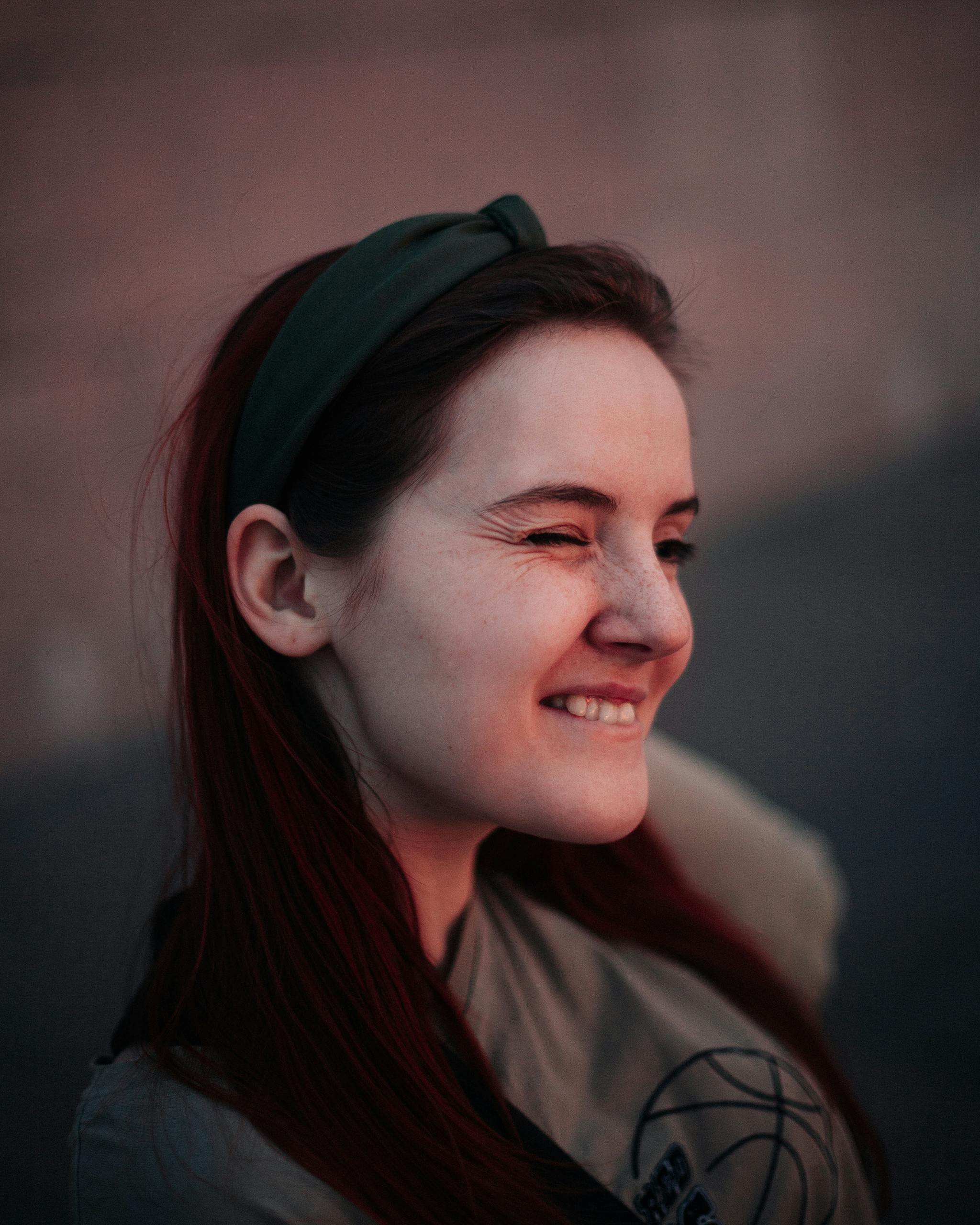 A Beautiful Woman in Red Dress Pouting Her Lips with Her Eyes Closed ...