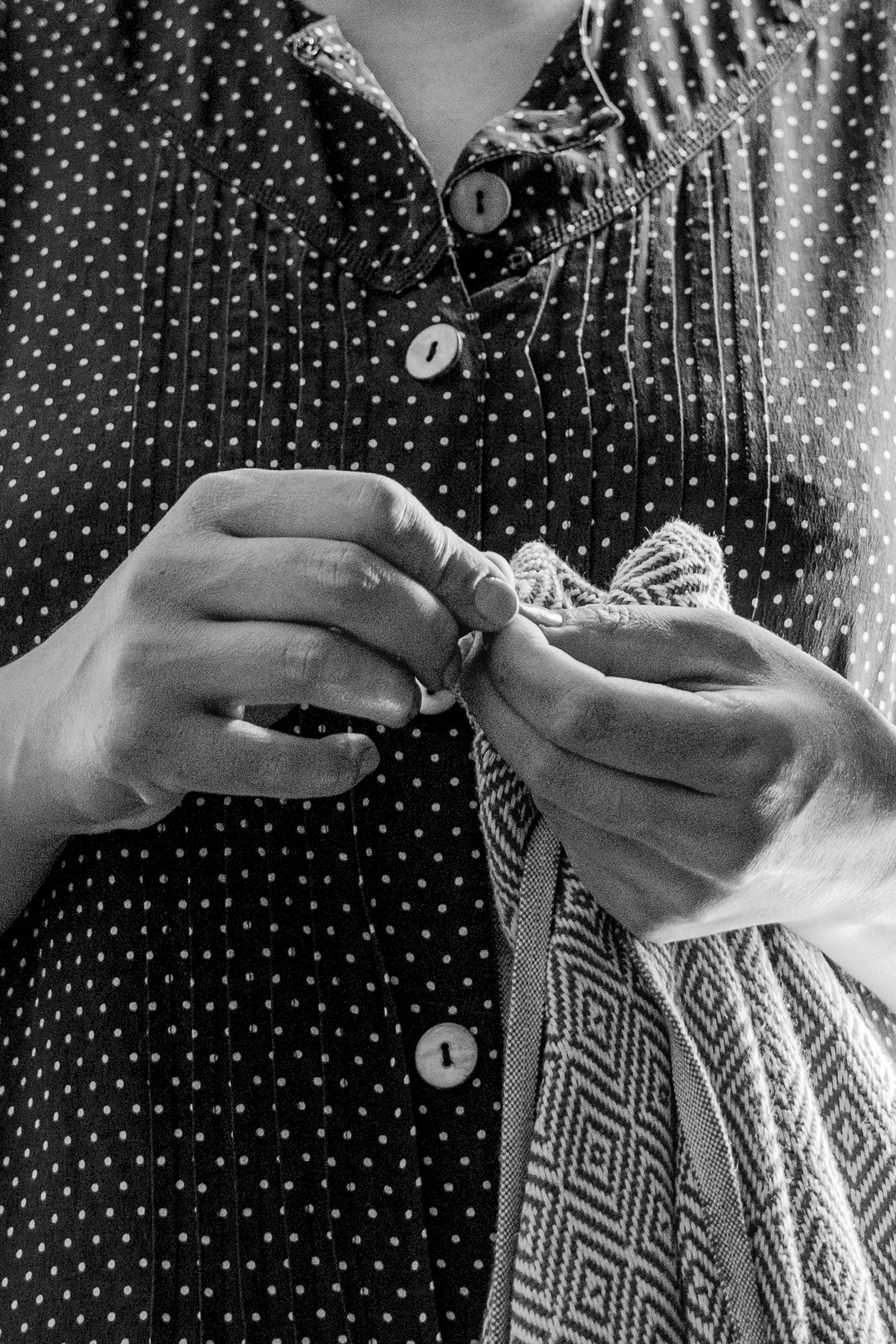 Black and White Photo of a Woman Holding a Cloth · Free Stock Photo