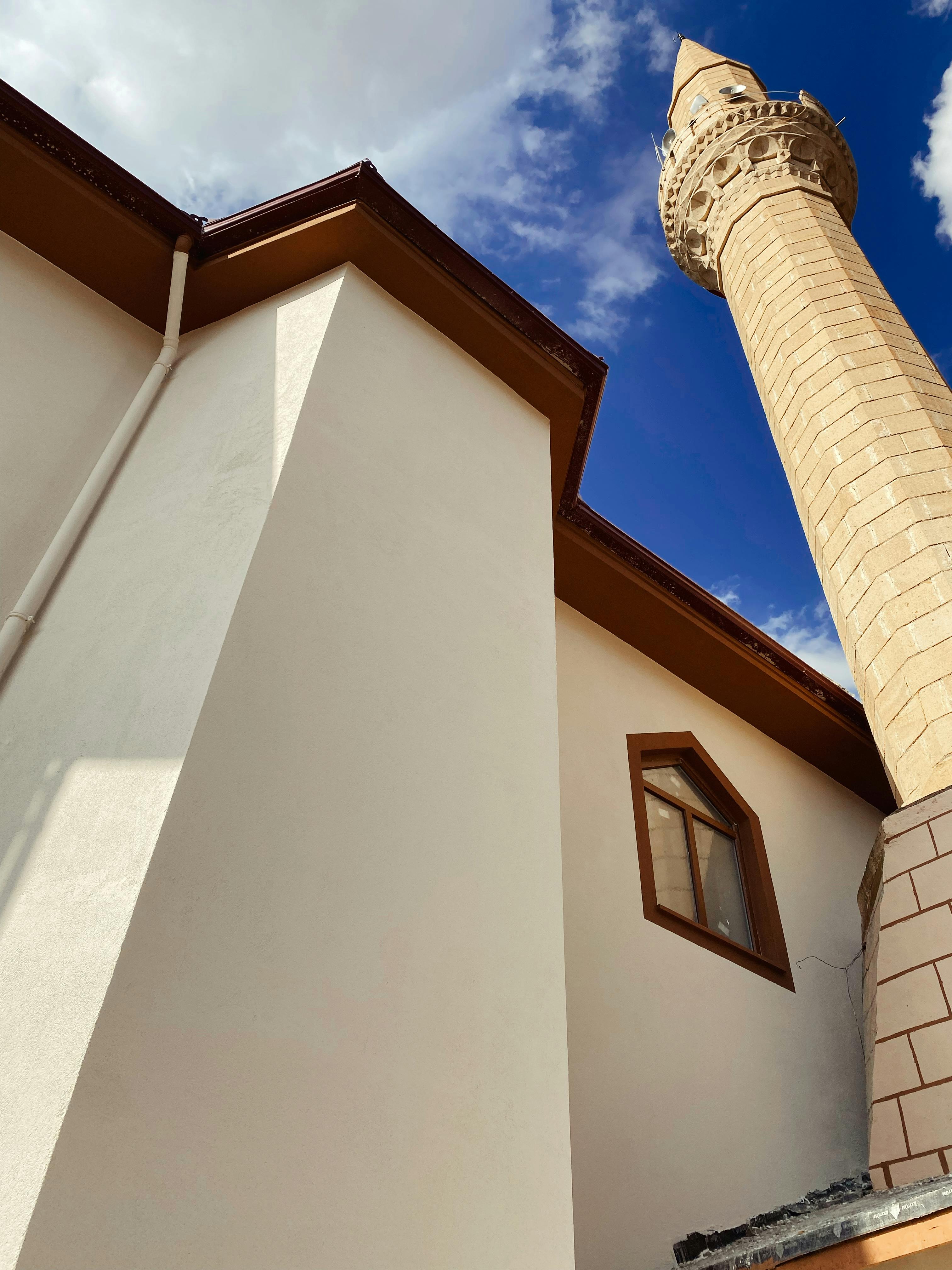 Man Standing Under An Arch Of Building · Free Stock Photo