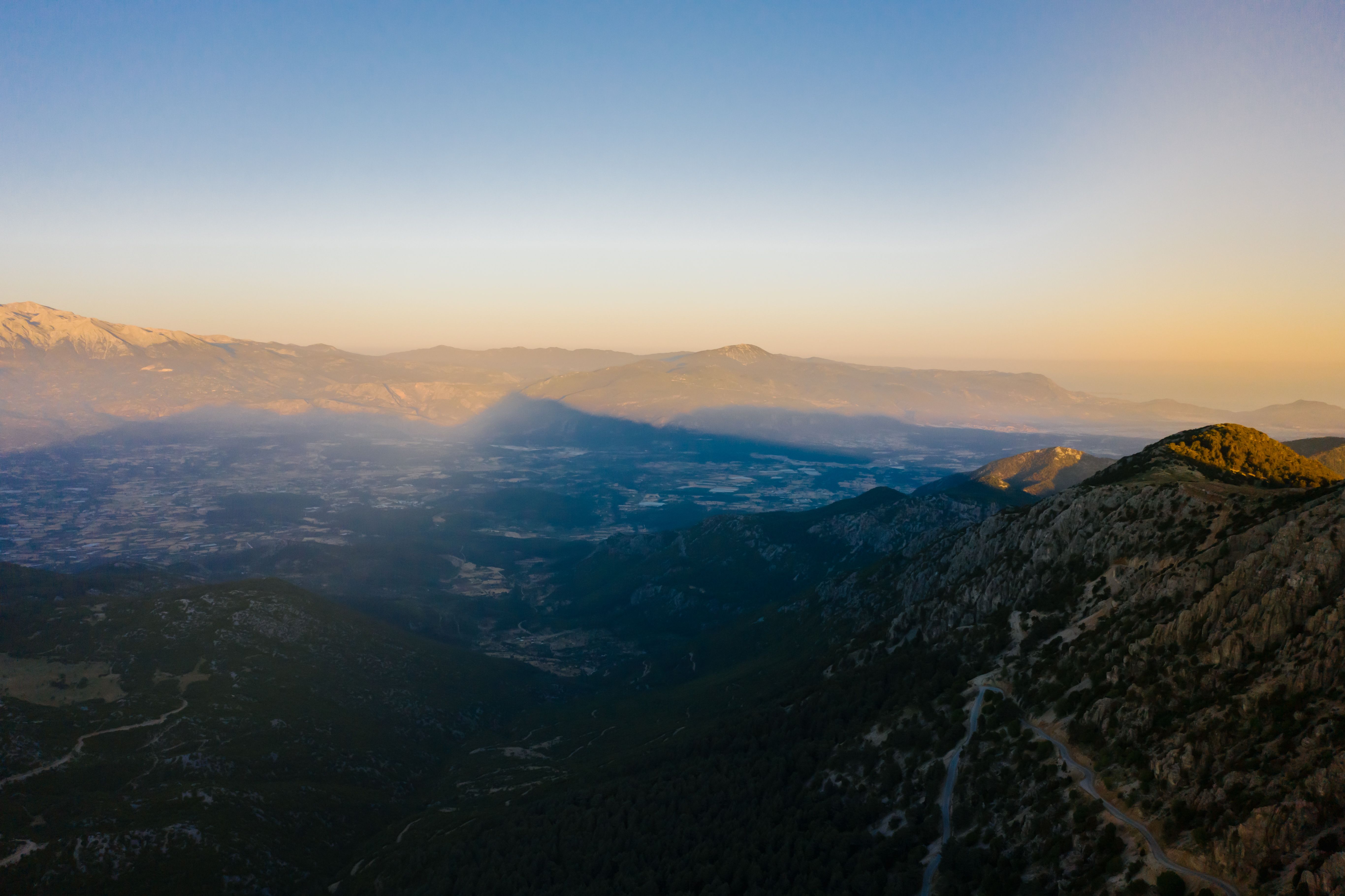Aerial View of Mountains and Valley at Sunset · Free Stock Photo