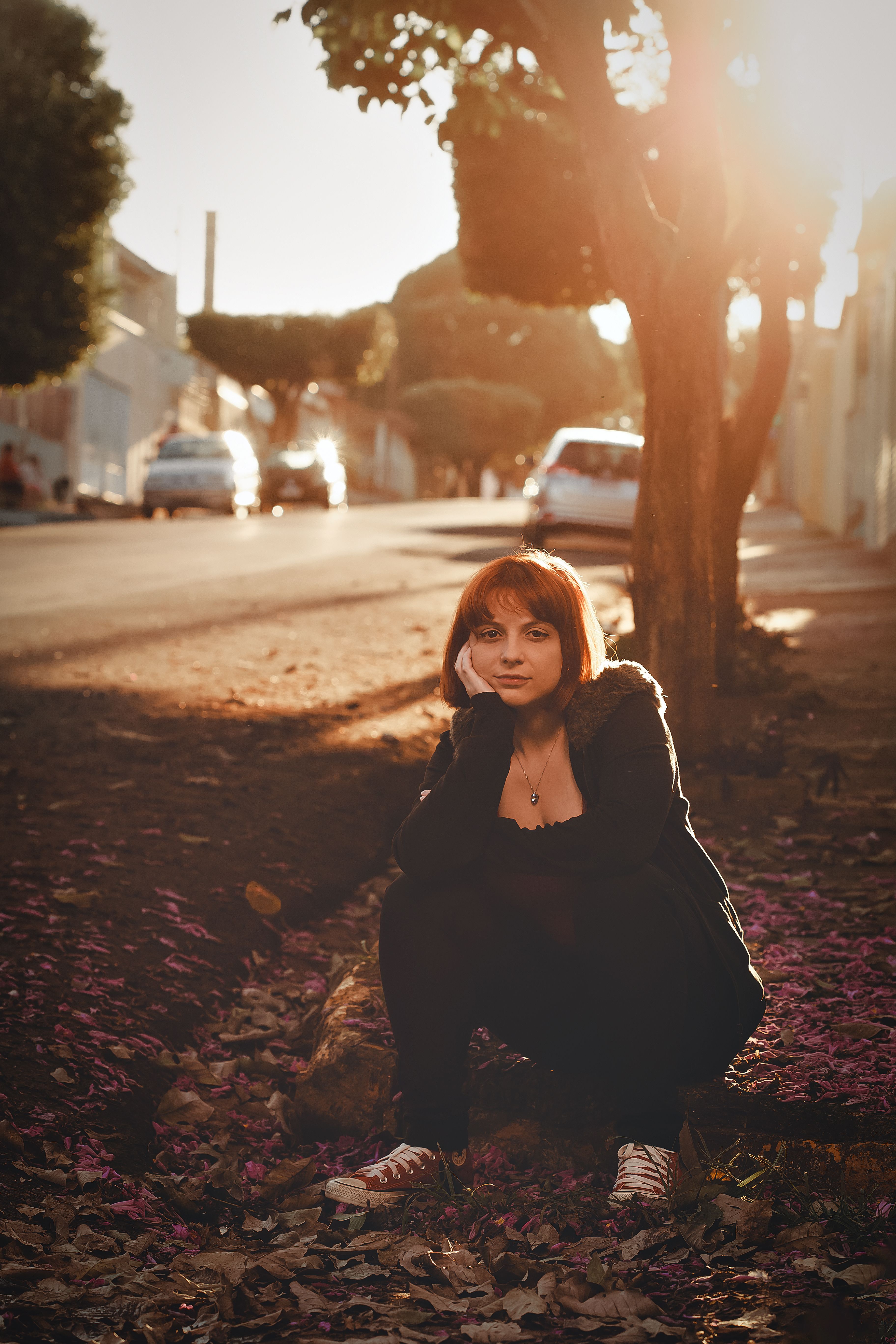 Woman Sitting at Roadside in Autumn · Free Stock Photo