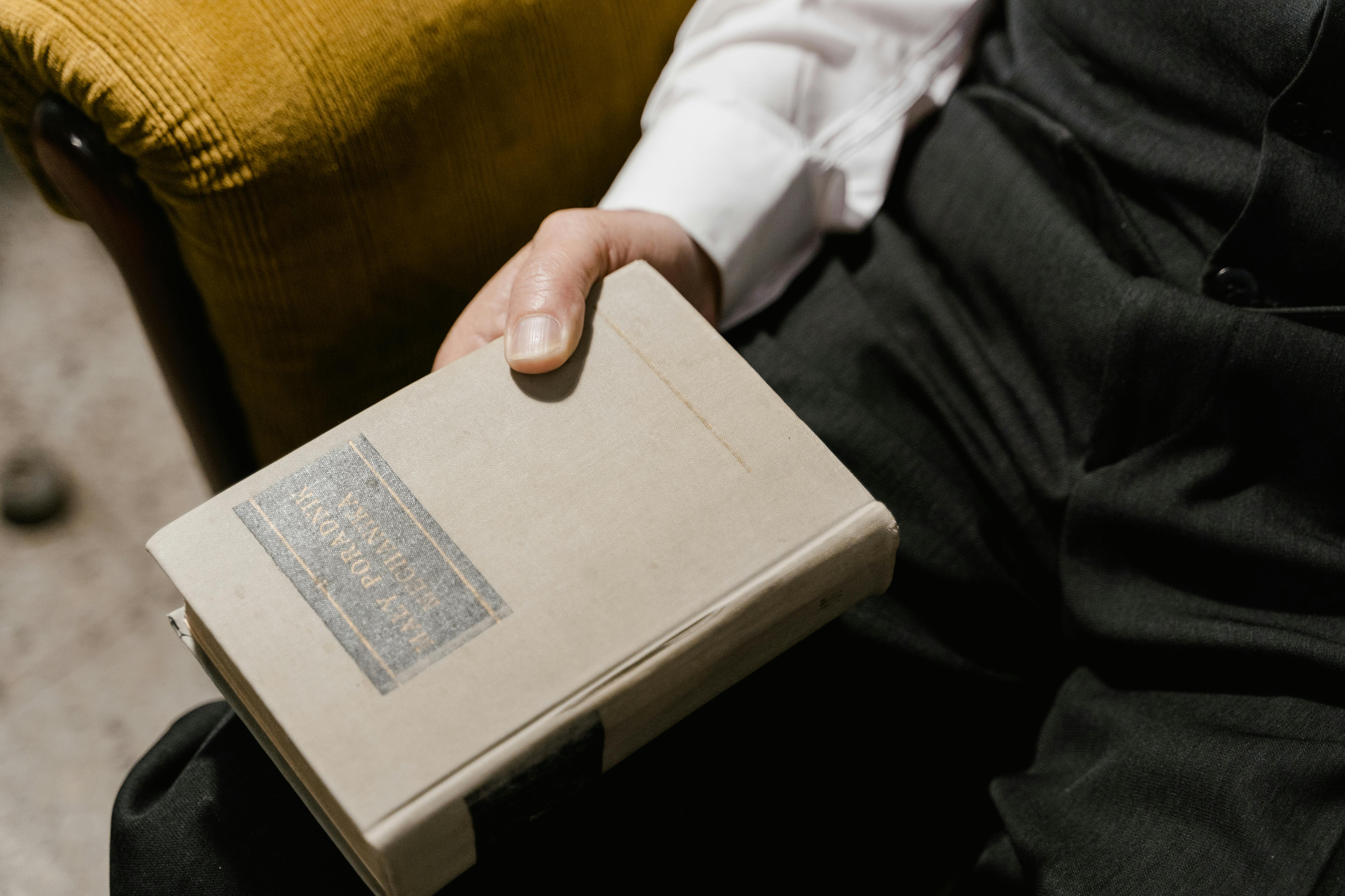 A Person Holding Brown Book · Free Stock Photo