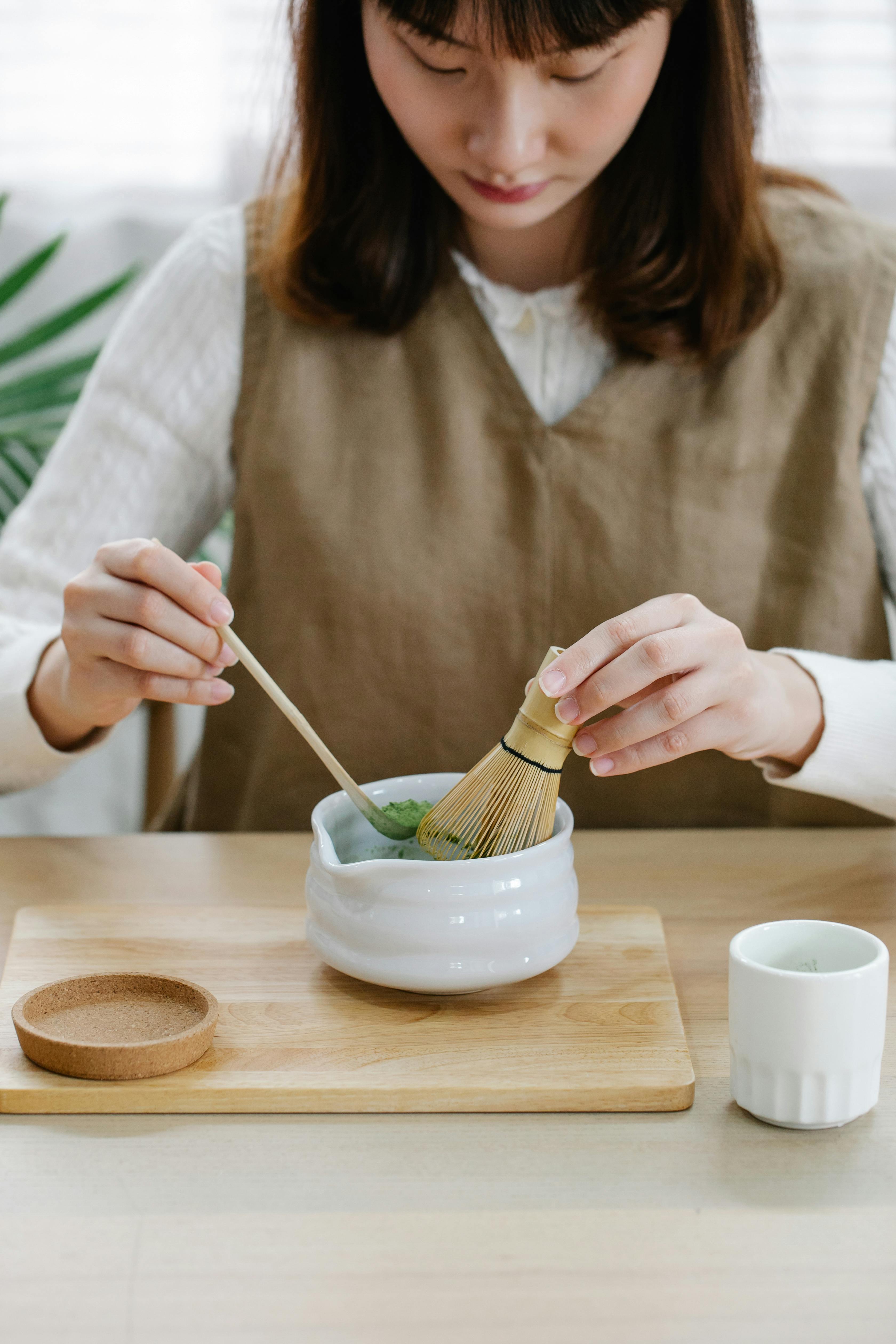 Woman Preparing a Beverage · Free Stock Photo