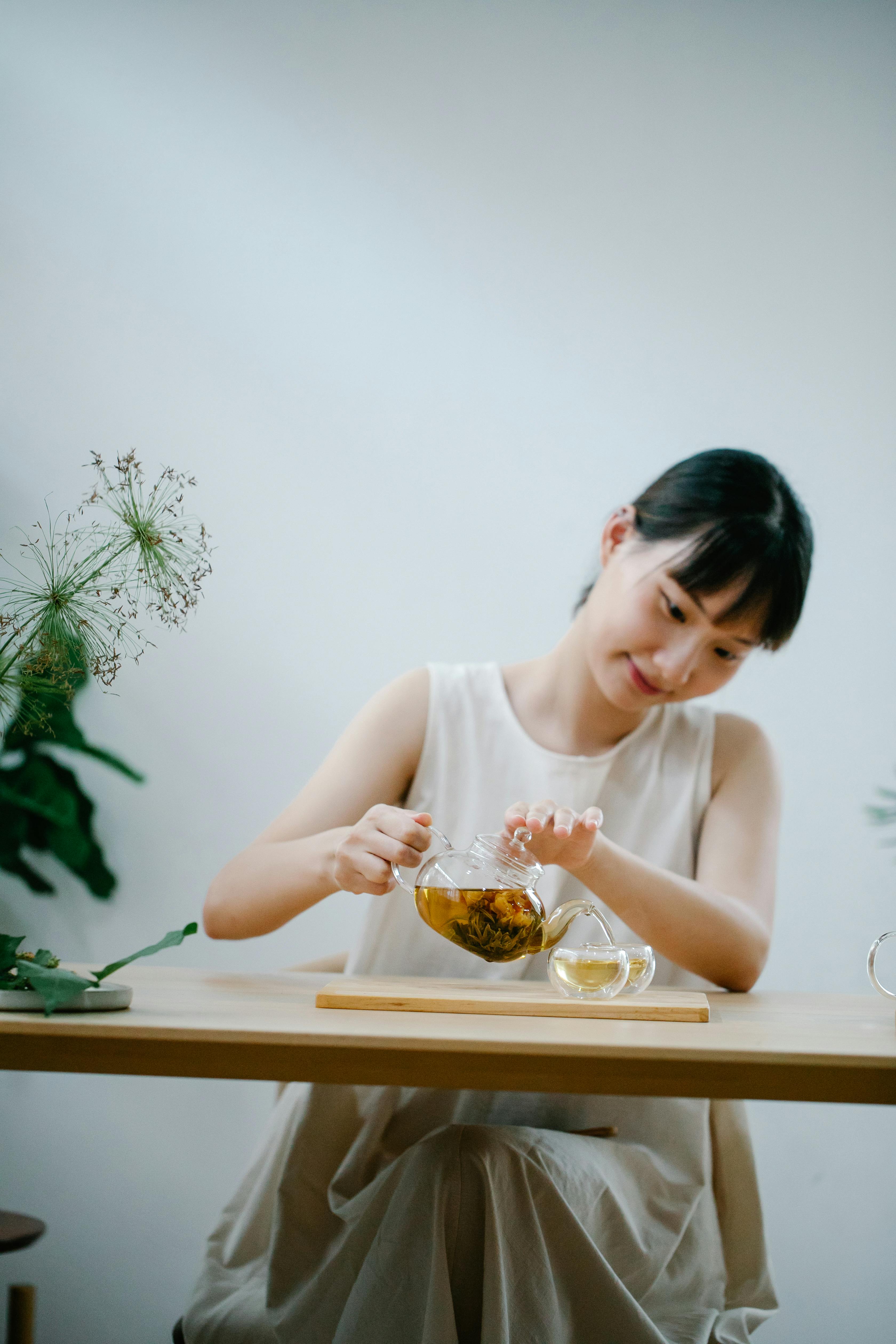 Woman Pouring Tea · Free Stock Photo