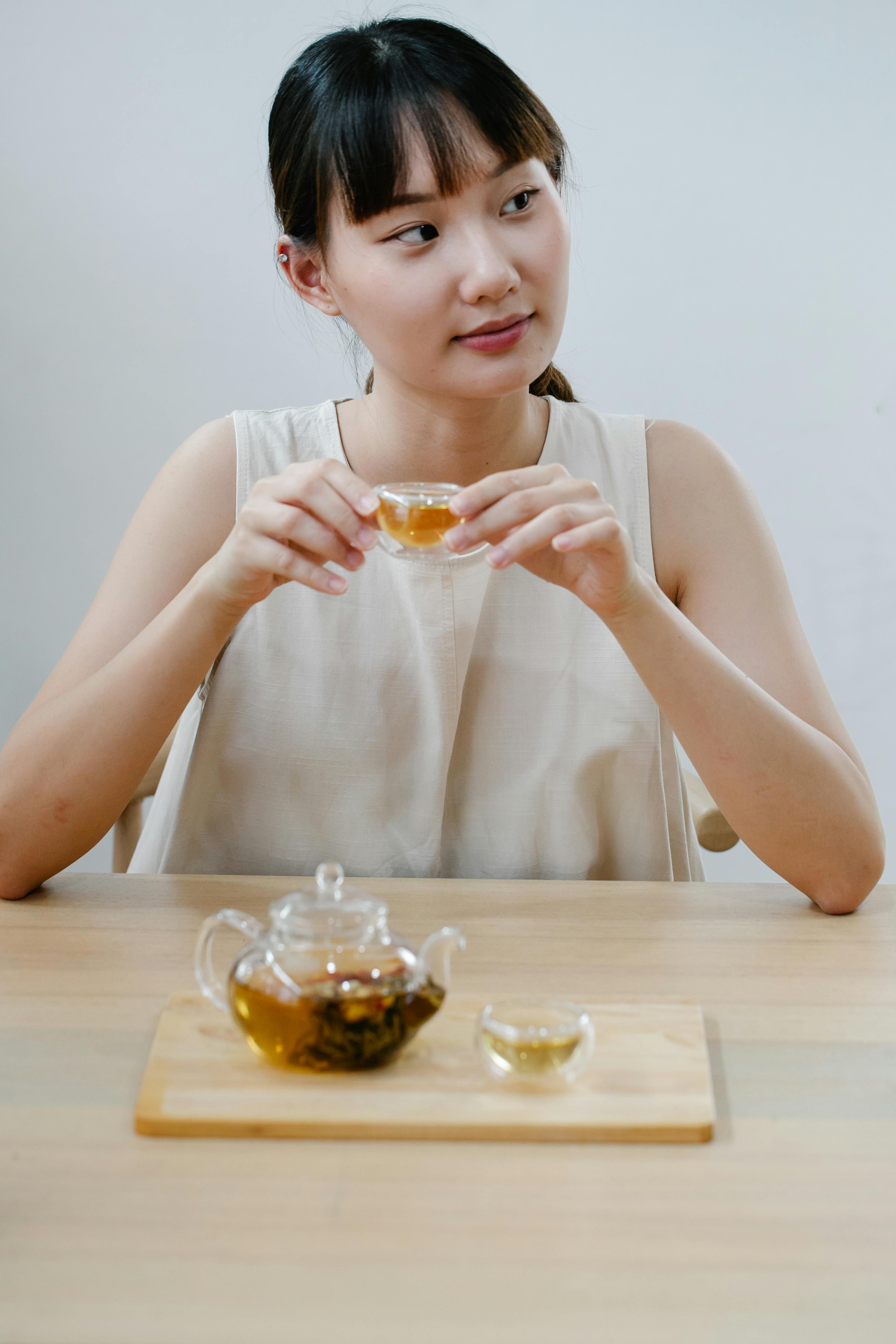 Woman Holding Cup of Tea · Free Stock Photo