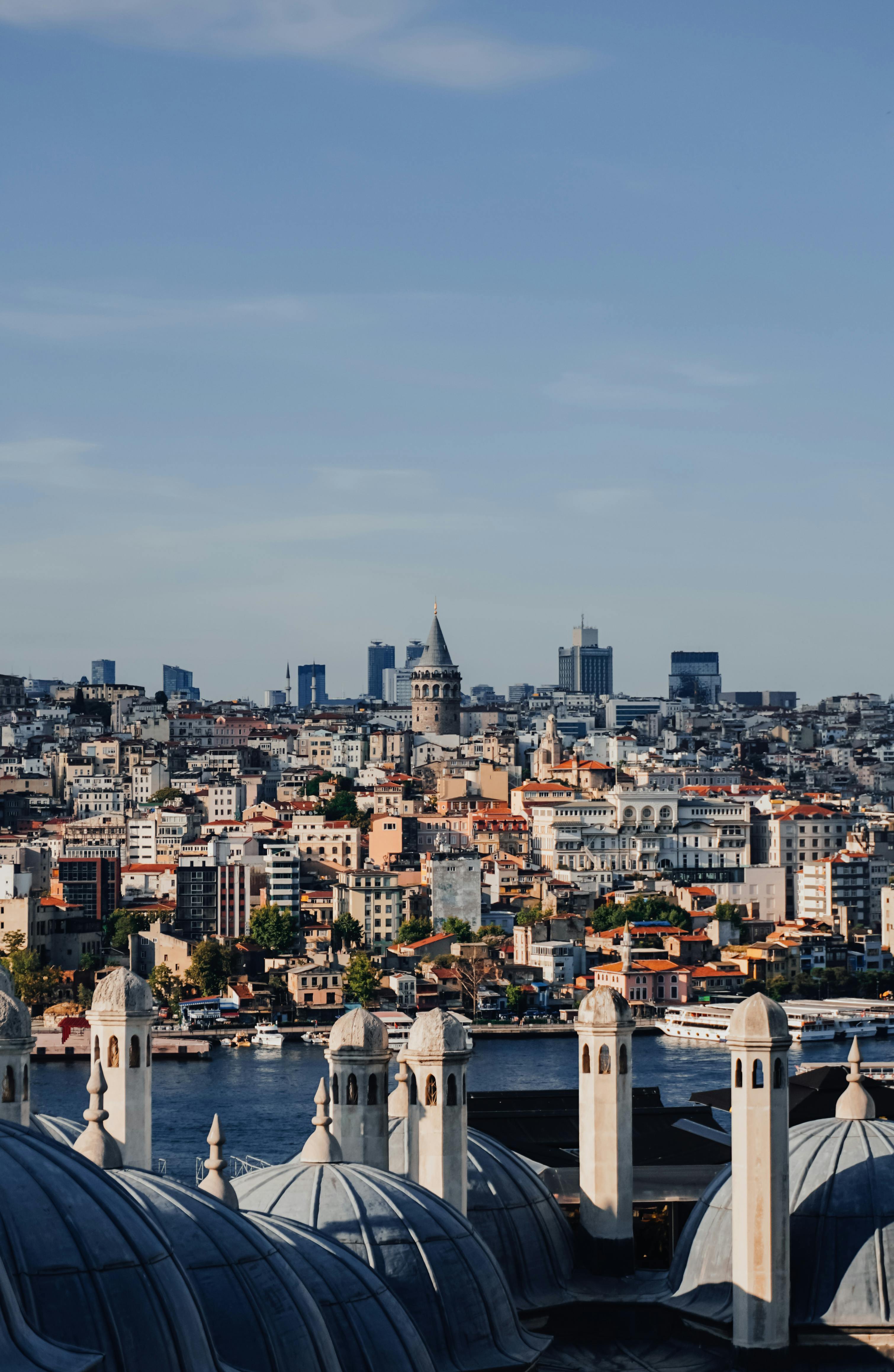 City Skyline Across Body of Water during Night Time · Free Stock Photo