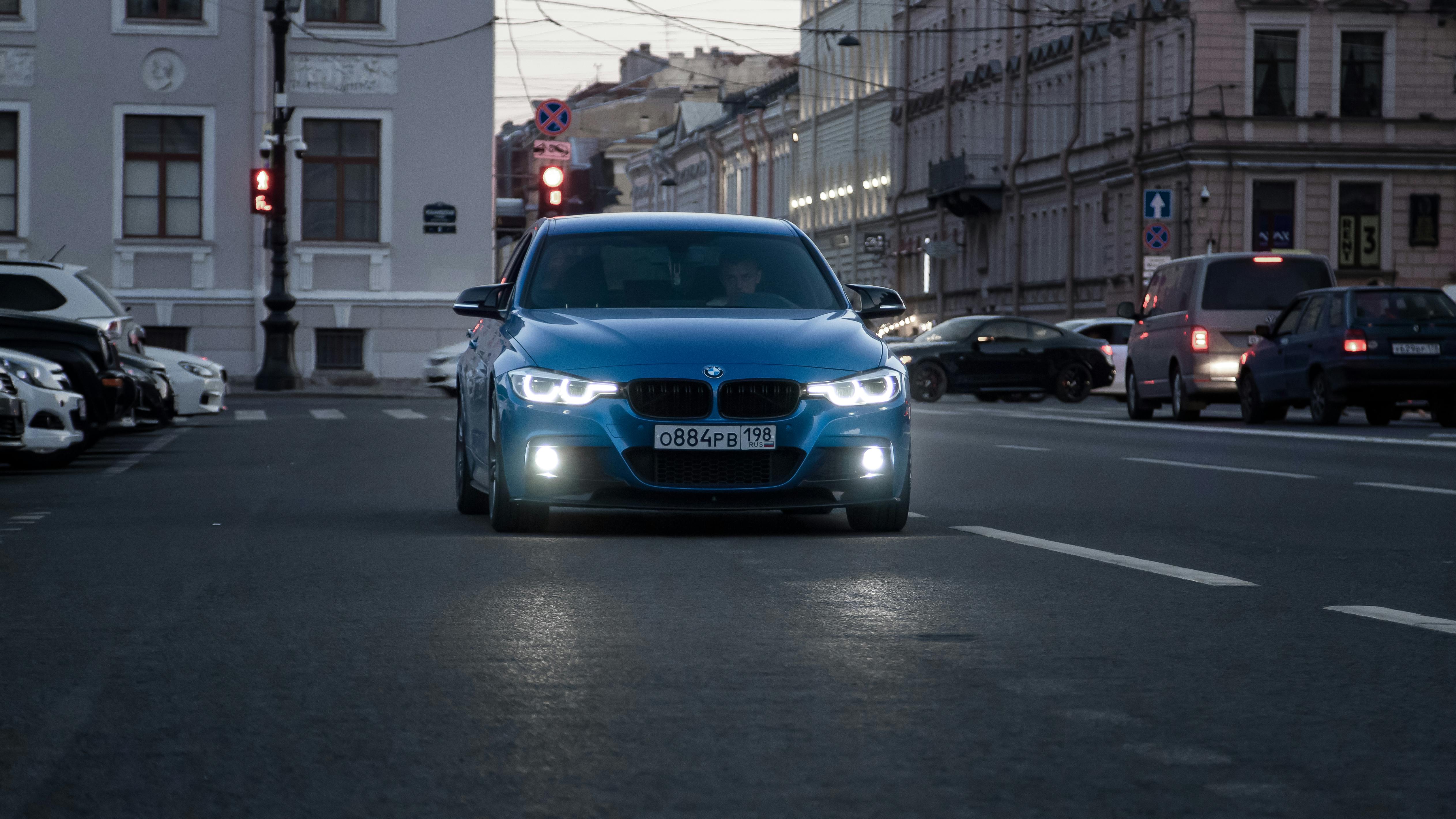 A Blue Car on the Road · Free Stock Photo